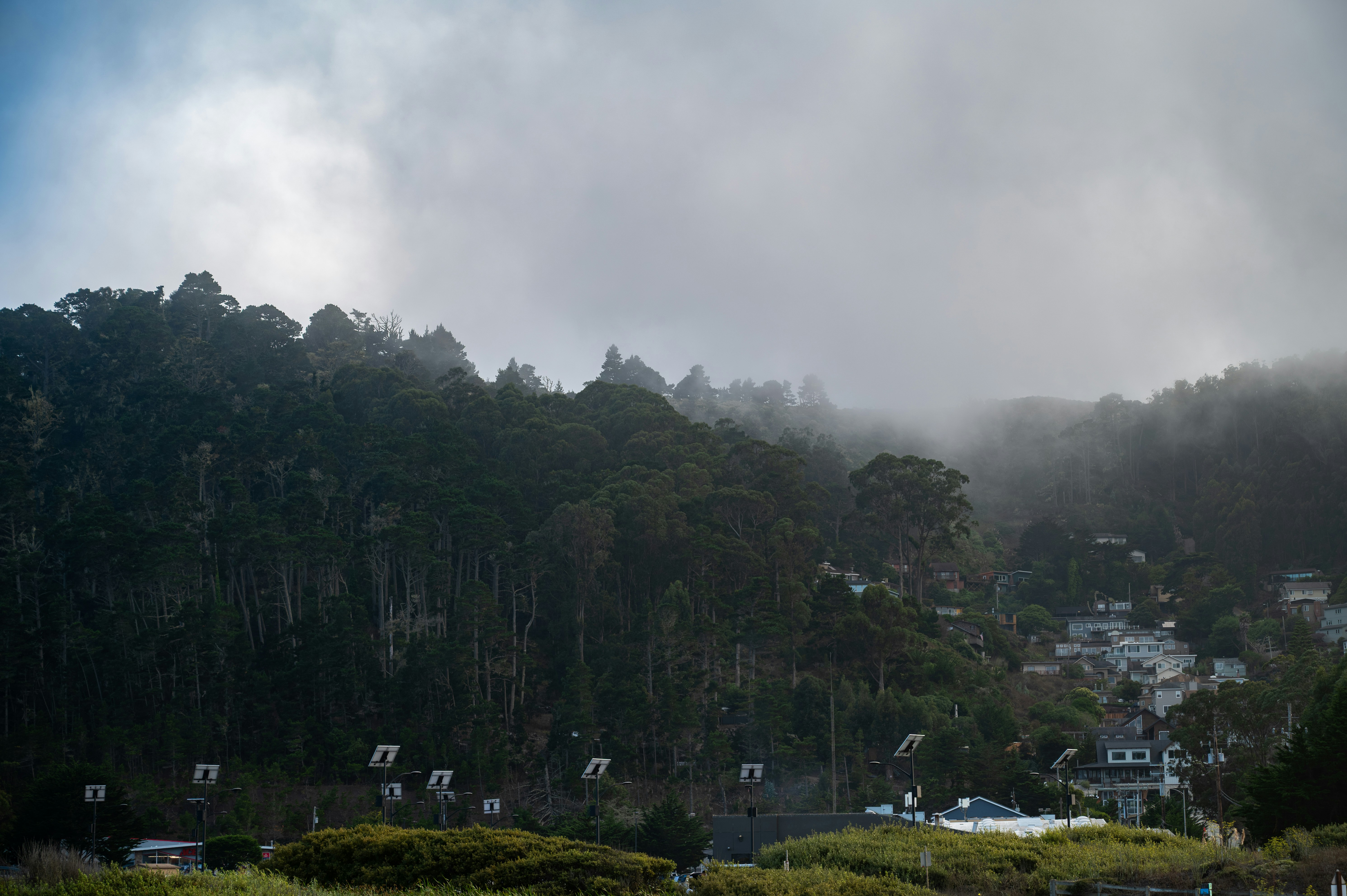 Mist over a hillside town: quiet morning with distant houses