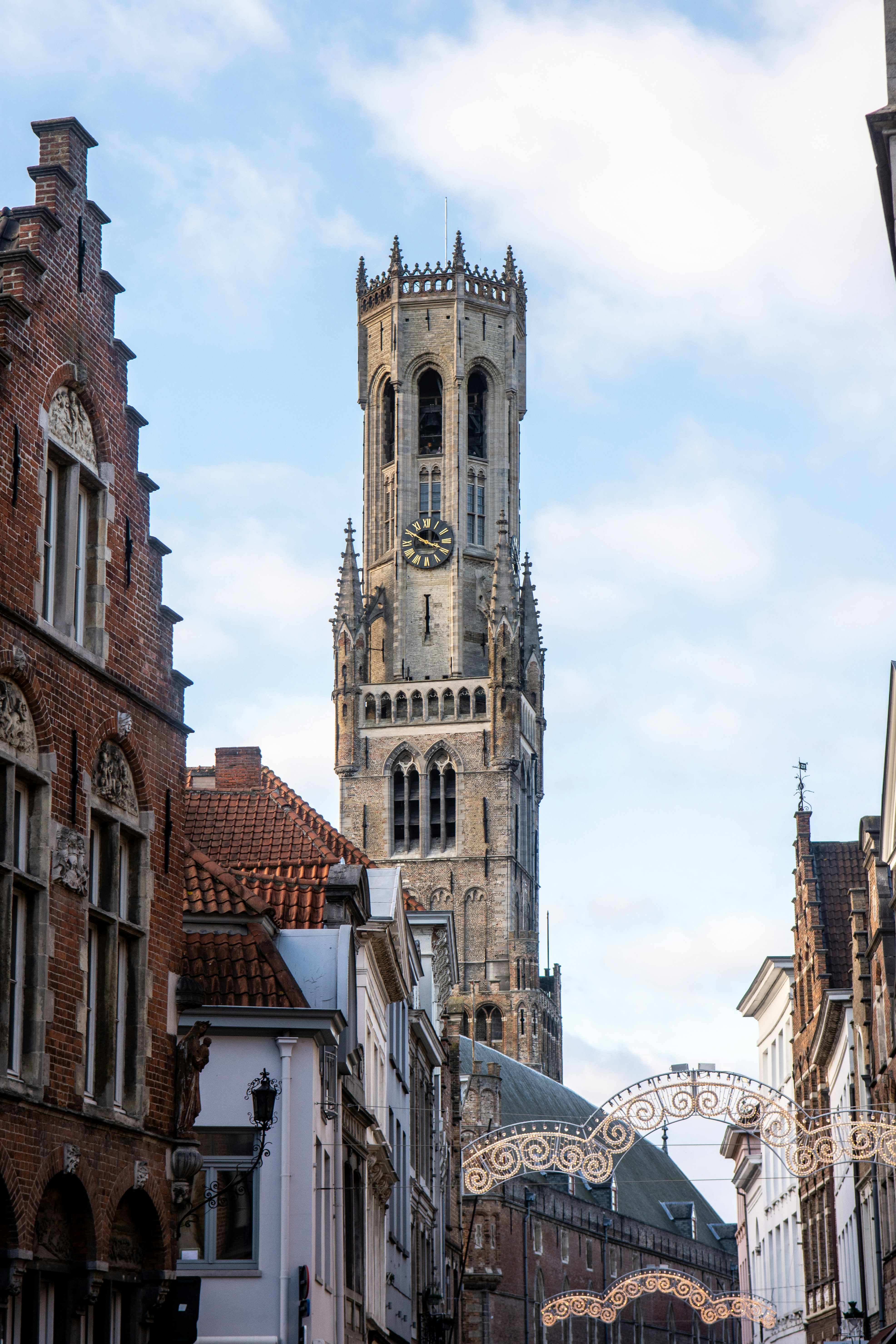 Gothic Clocktower Piercing a Canal-Edge Sky