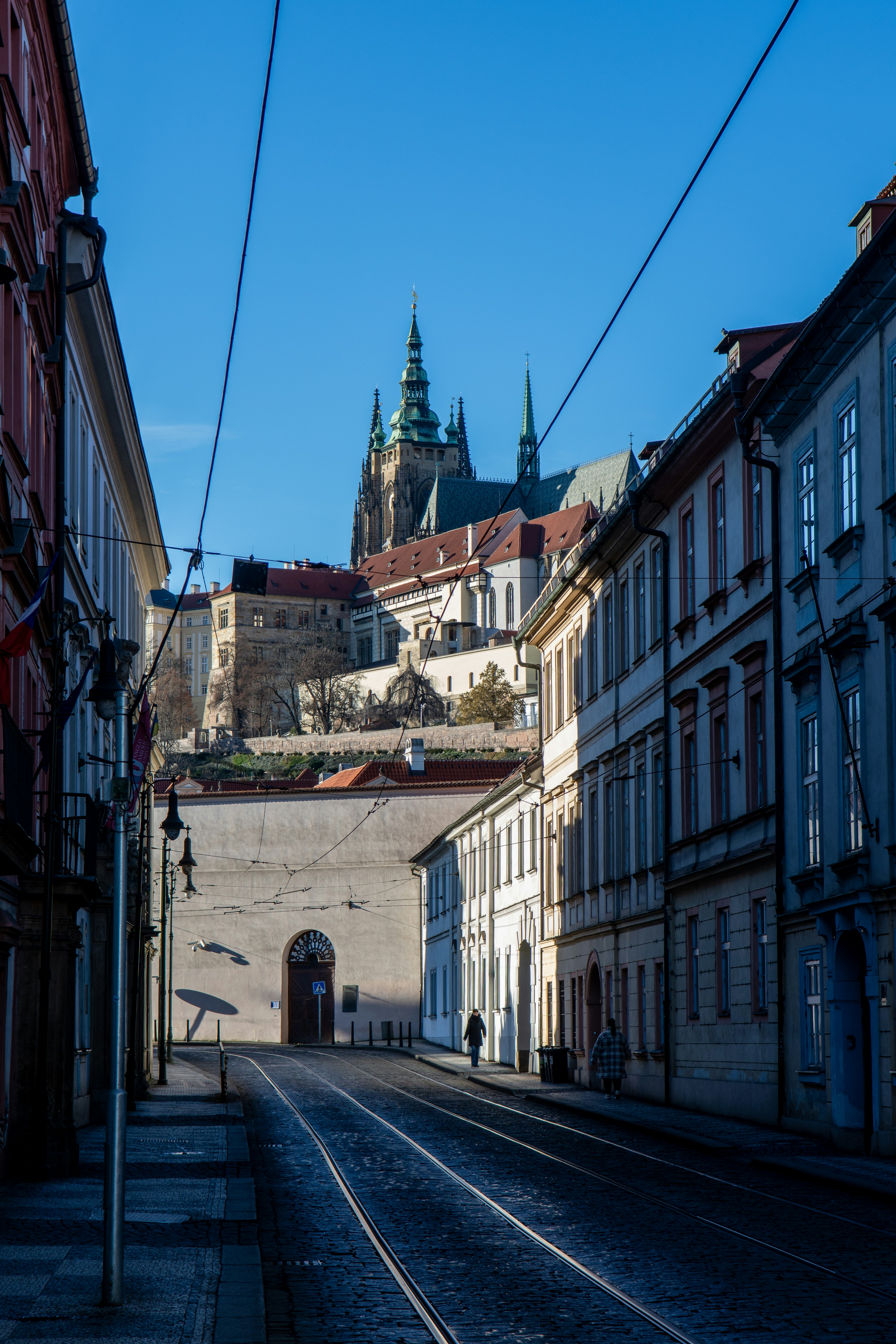 Gothic spires over a sunlit city street