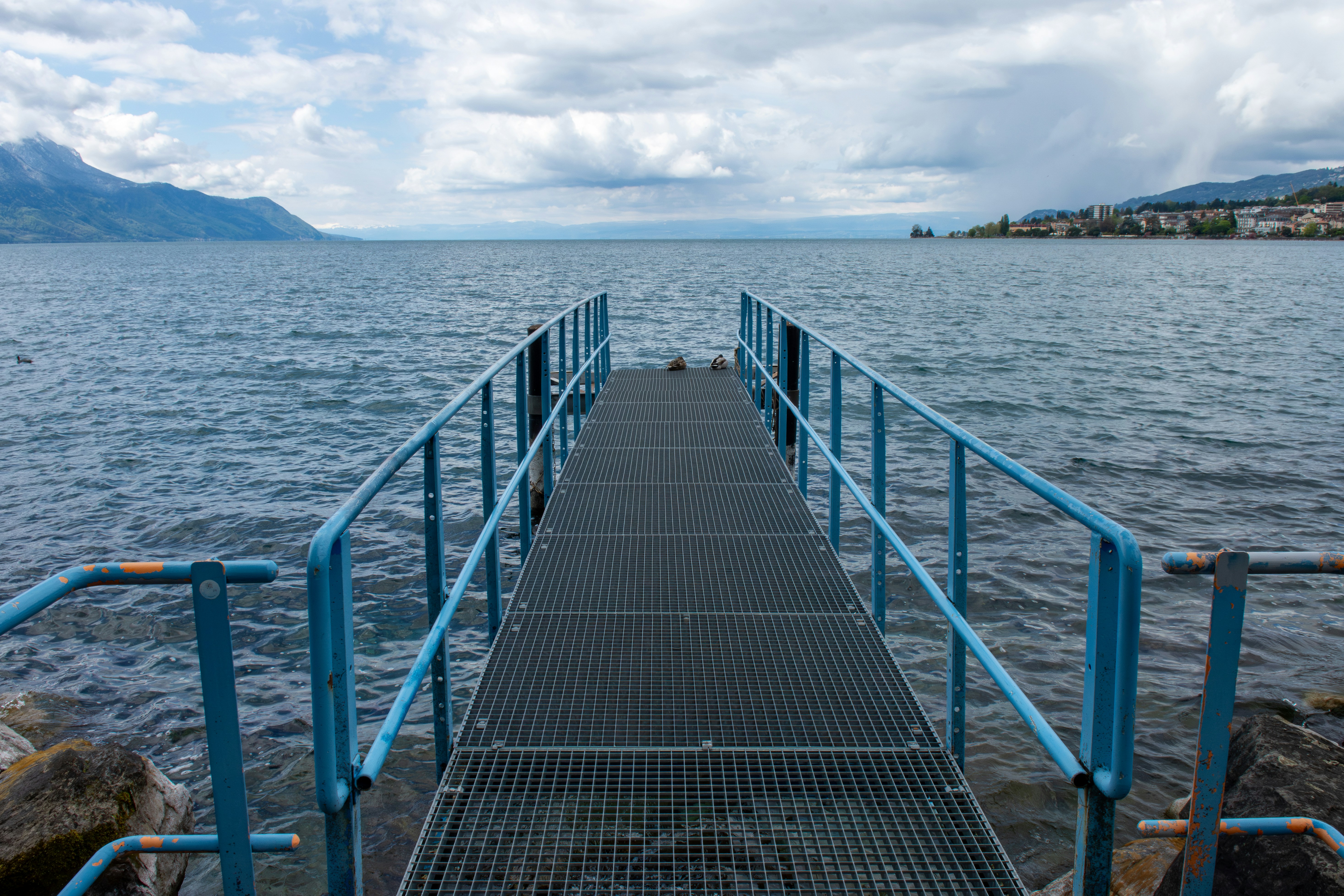Blue Pier Stretching Toward a Quiet Horizon