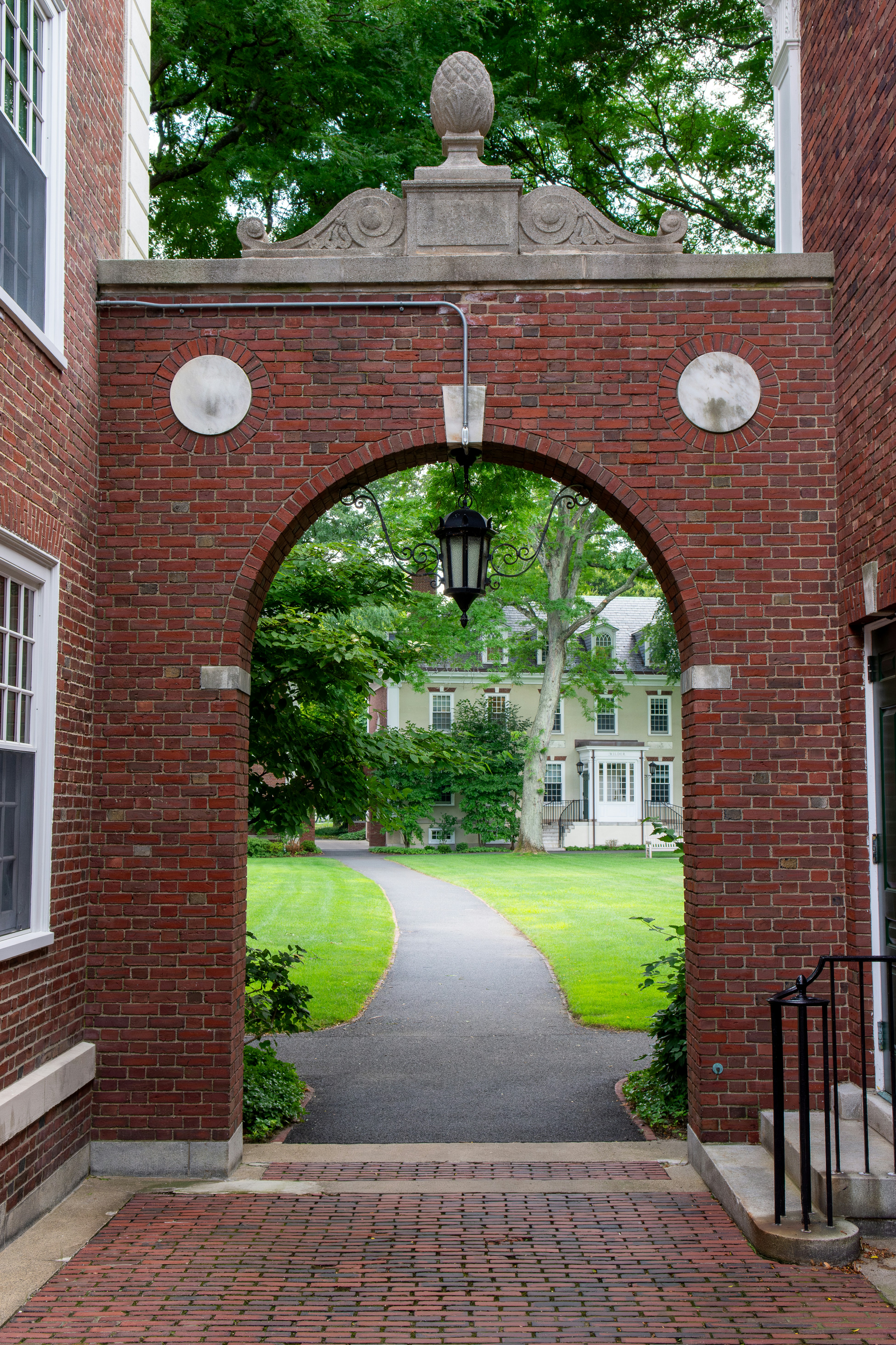 Brick Archway to a Green Campus Path