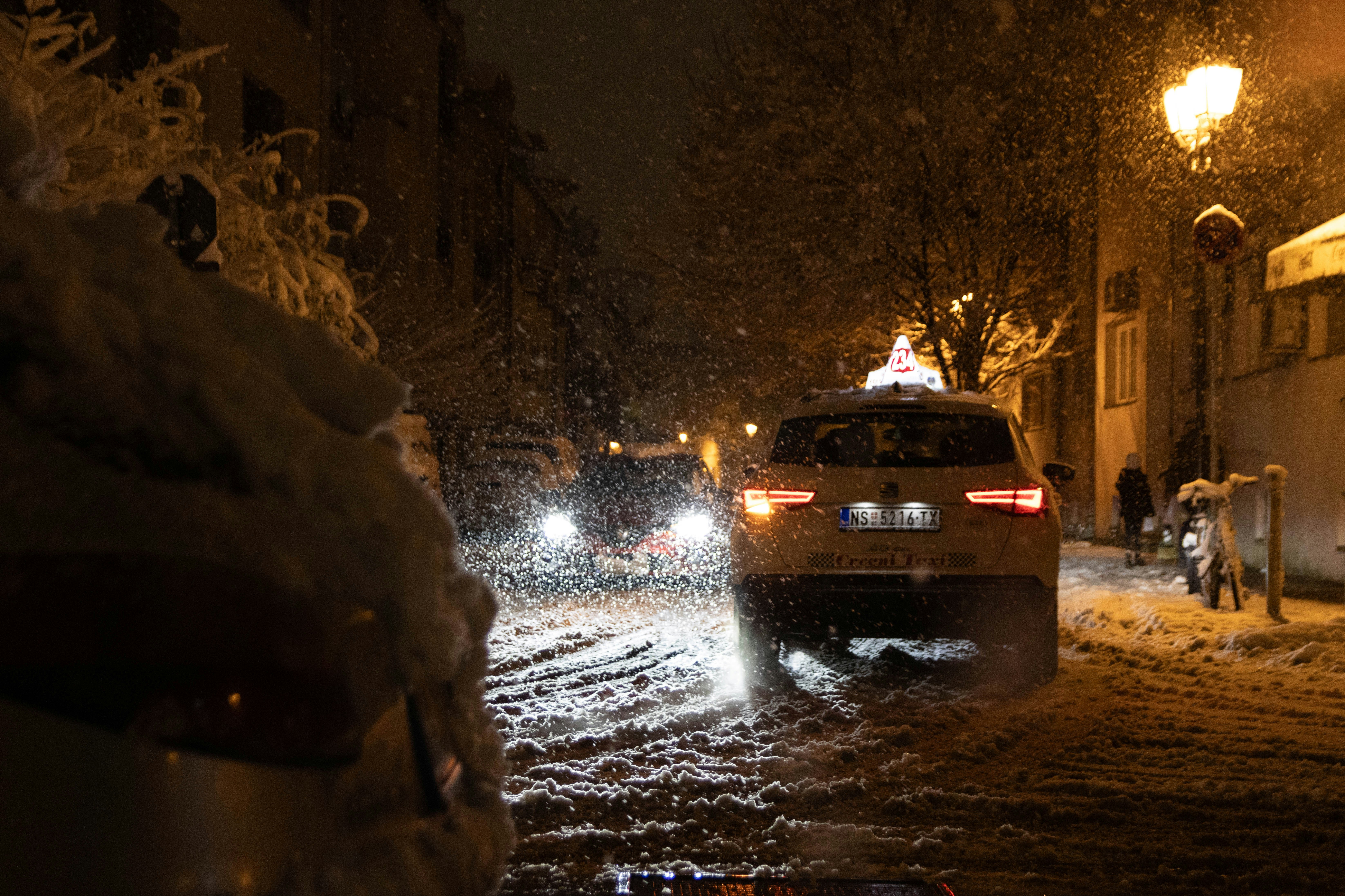 Headlights in the Snow: A Narrow Street Night Drive