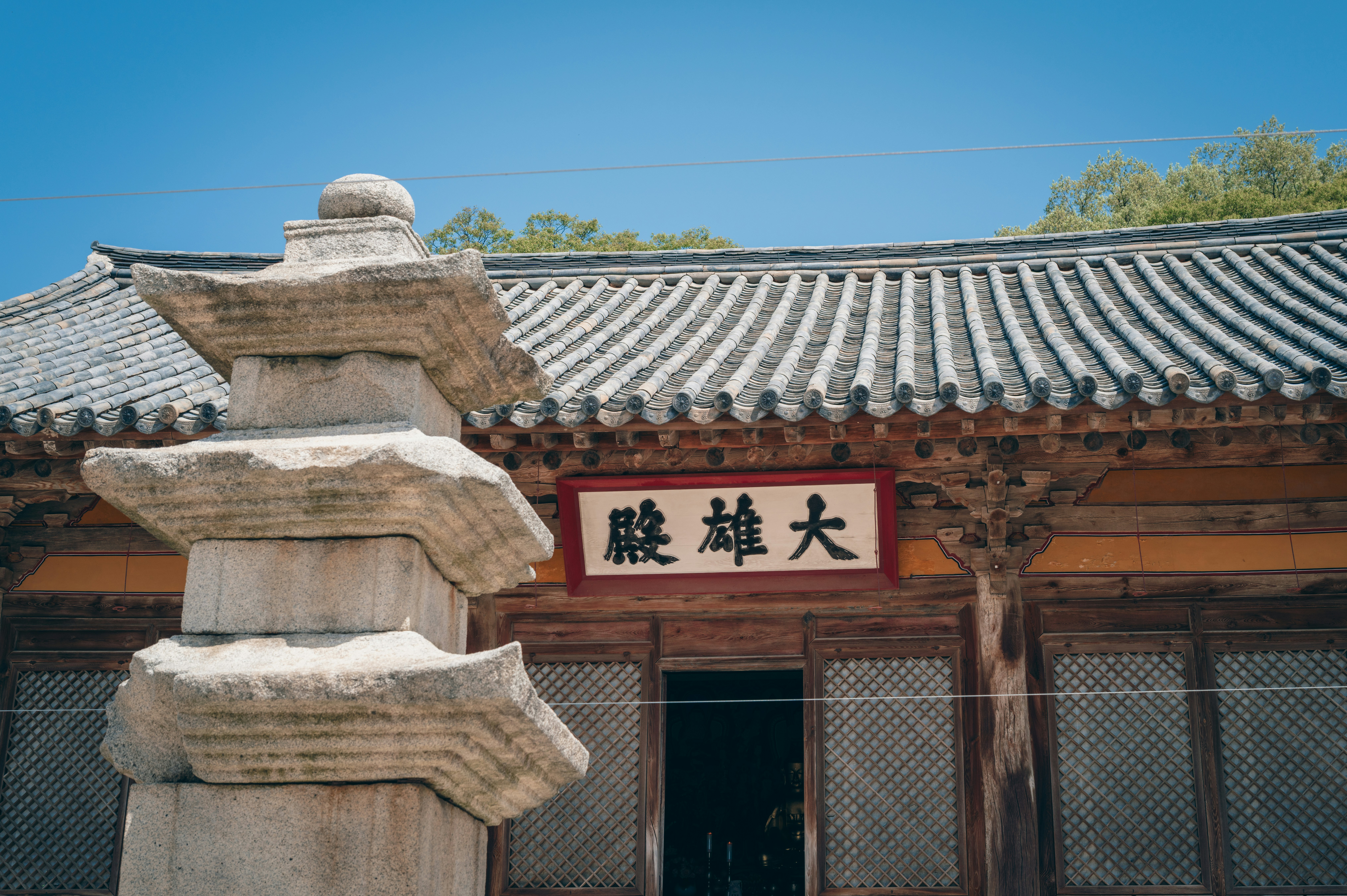 Stone Lantern and Traditional Gate: Quiet Ceremony Under the Tile Roof