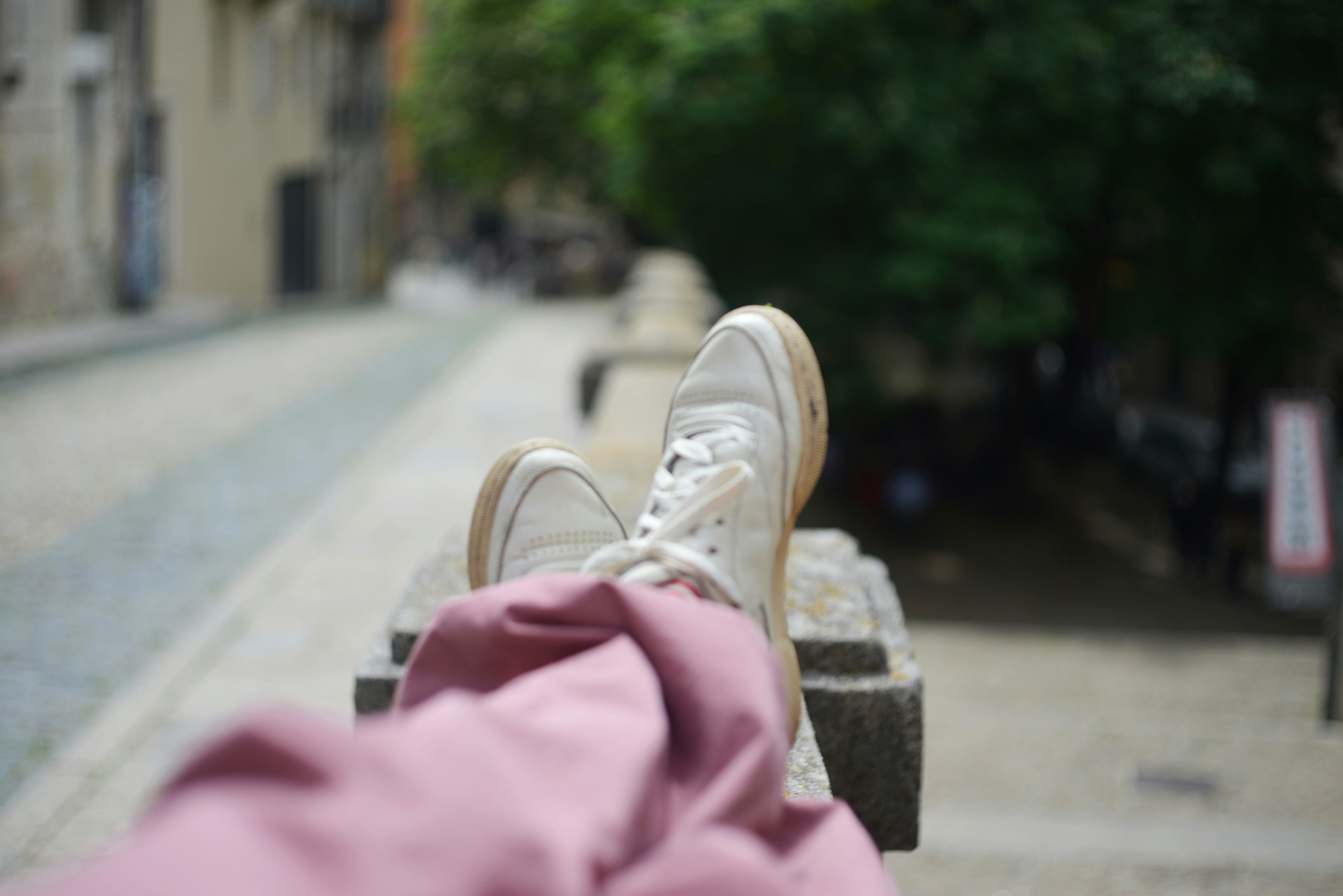Feet-up on the City Edge: A Quiet Pause Above the Cobblestones