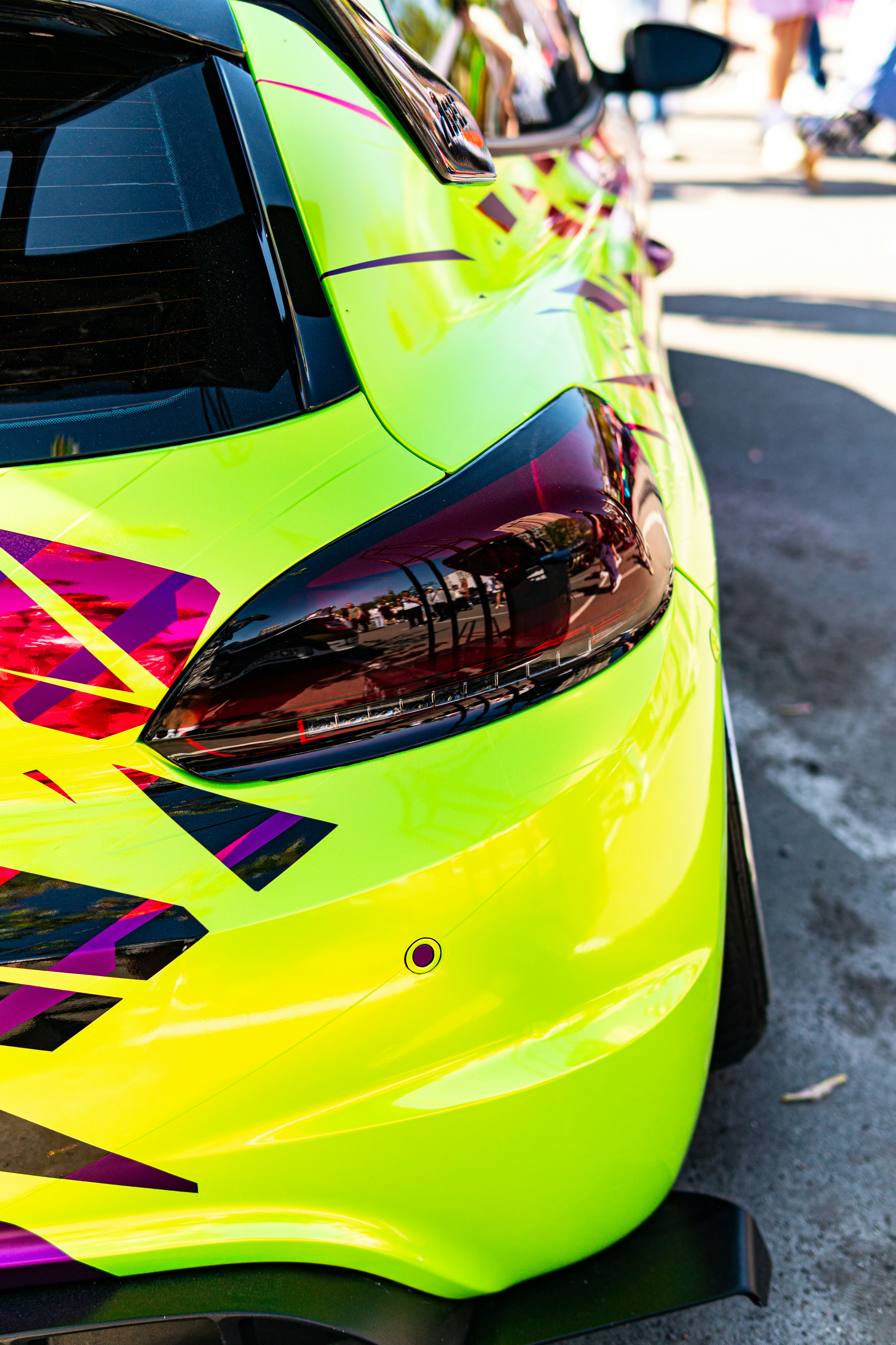 Neon Pursuit: Close-Up of a Vibrant Racing Car Tail