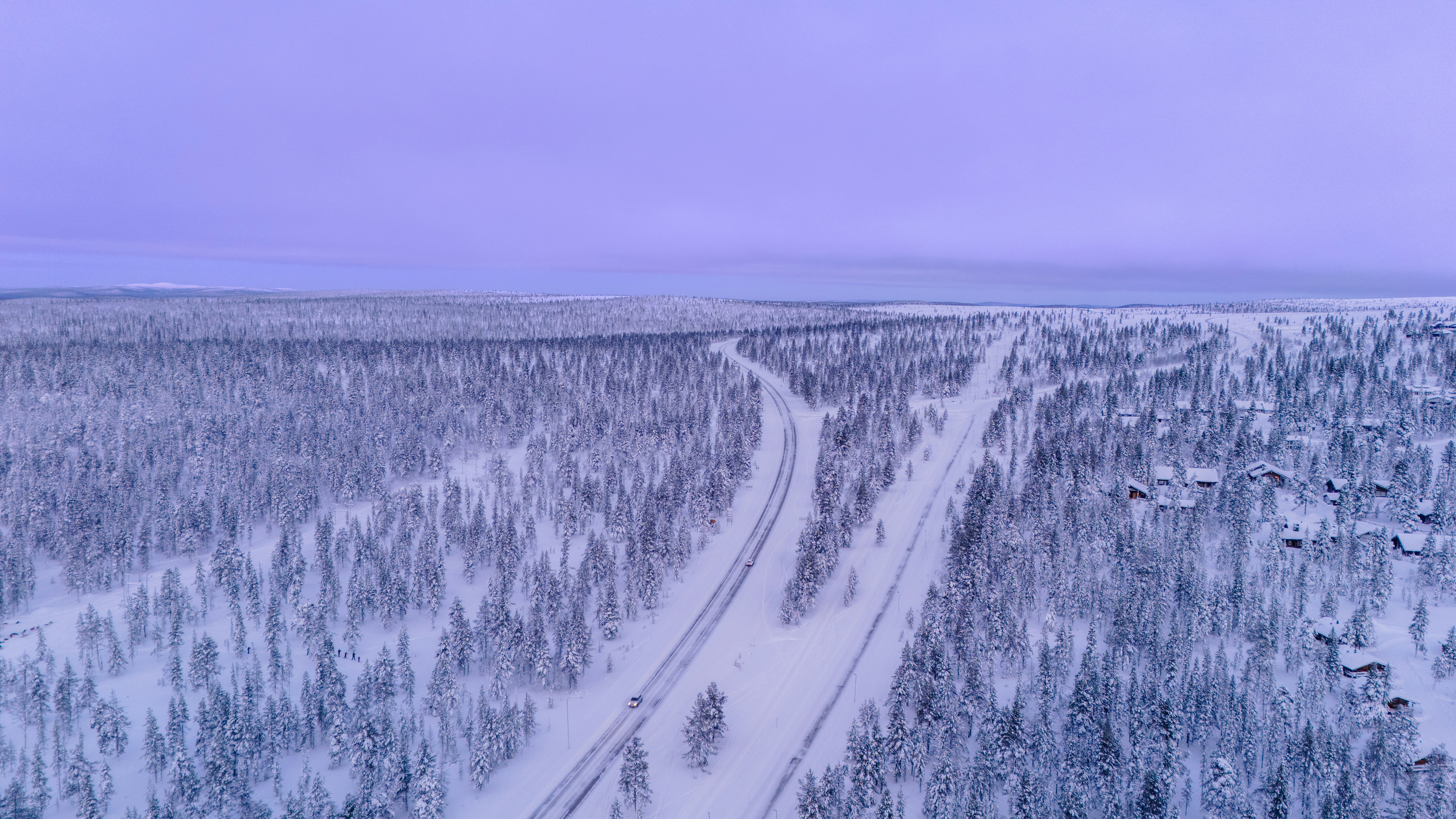Snowbound Transit: Aerial Path through a Frosted Wilderness