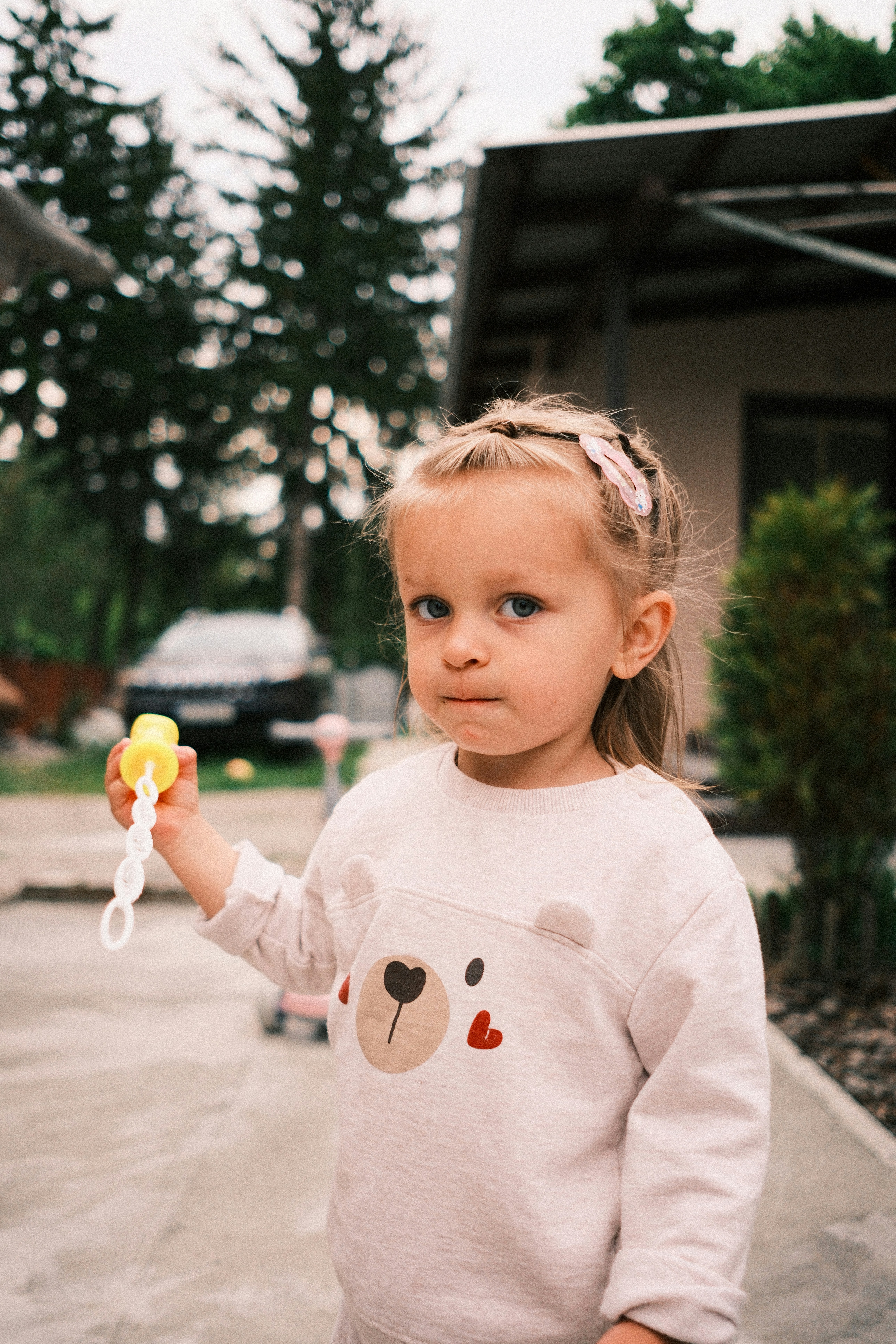 Soft-Cocused Portrait of a Curious Stranger with a Teething Toy