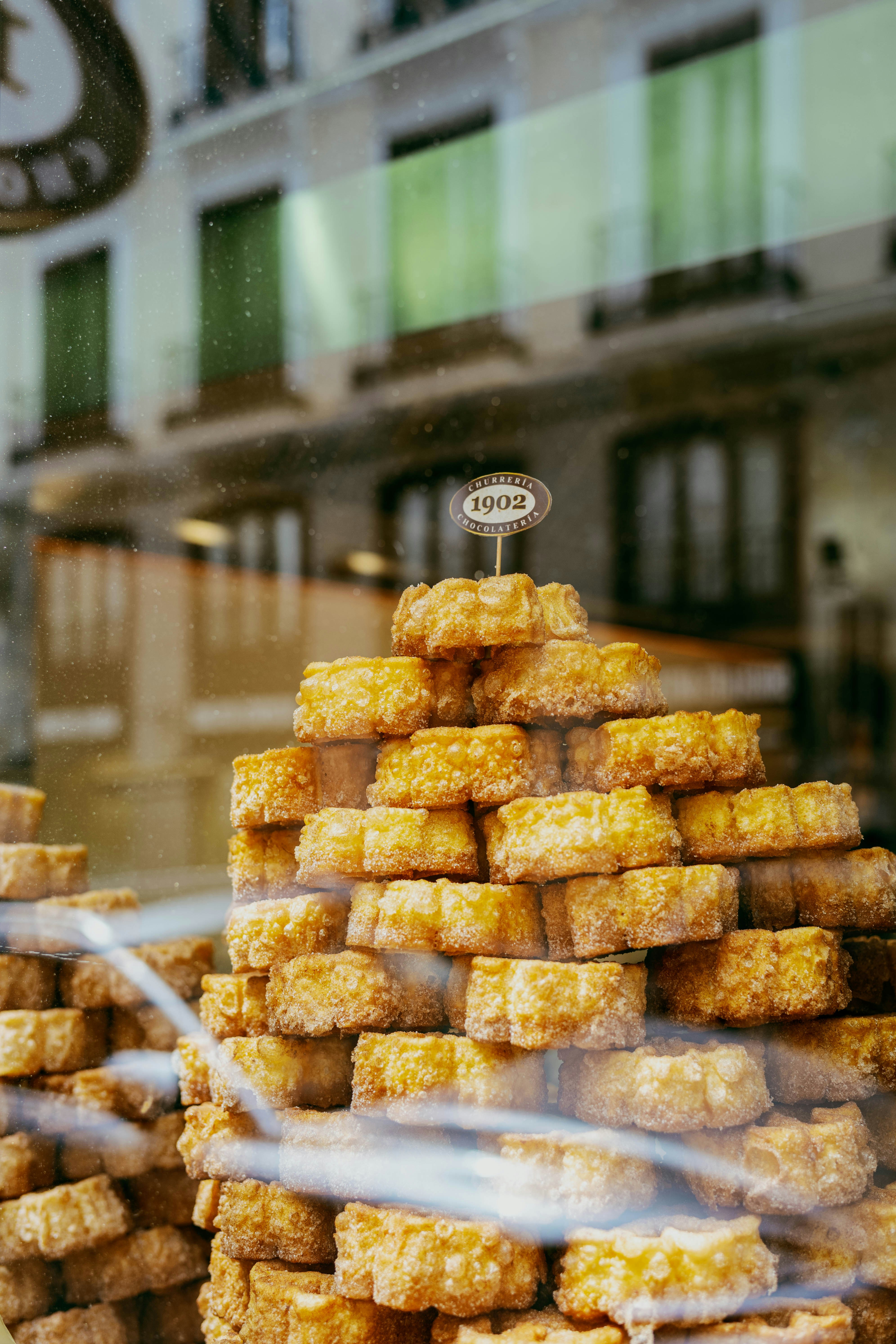 Sticky towers: a pastry display crowned with a tiny sign