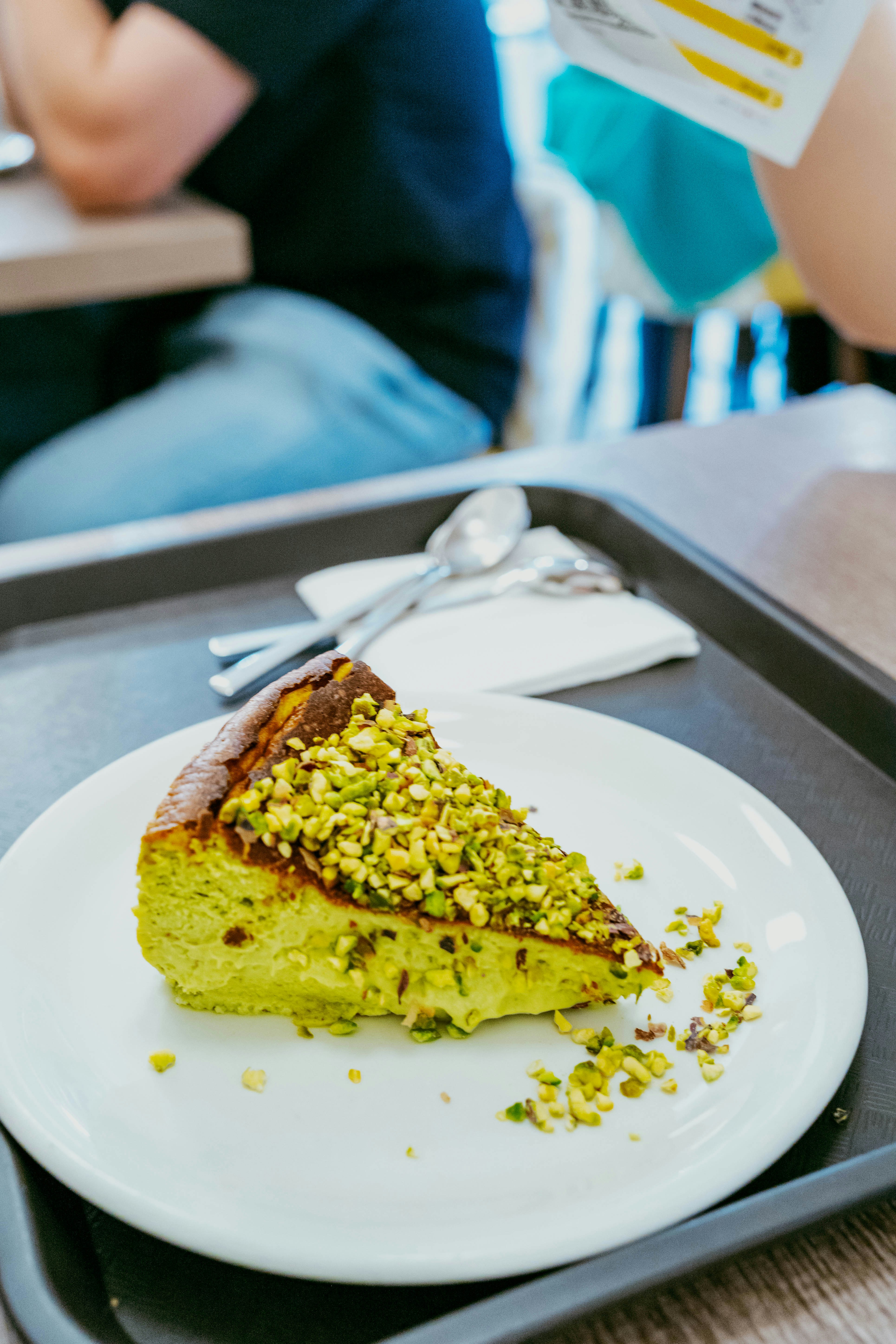 Lime-green Pistachio Cheesecake Slice on a Tray