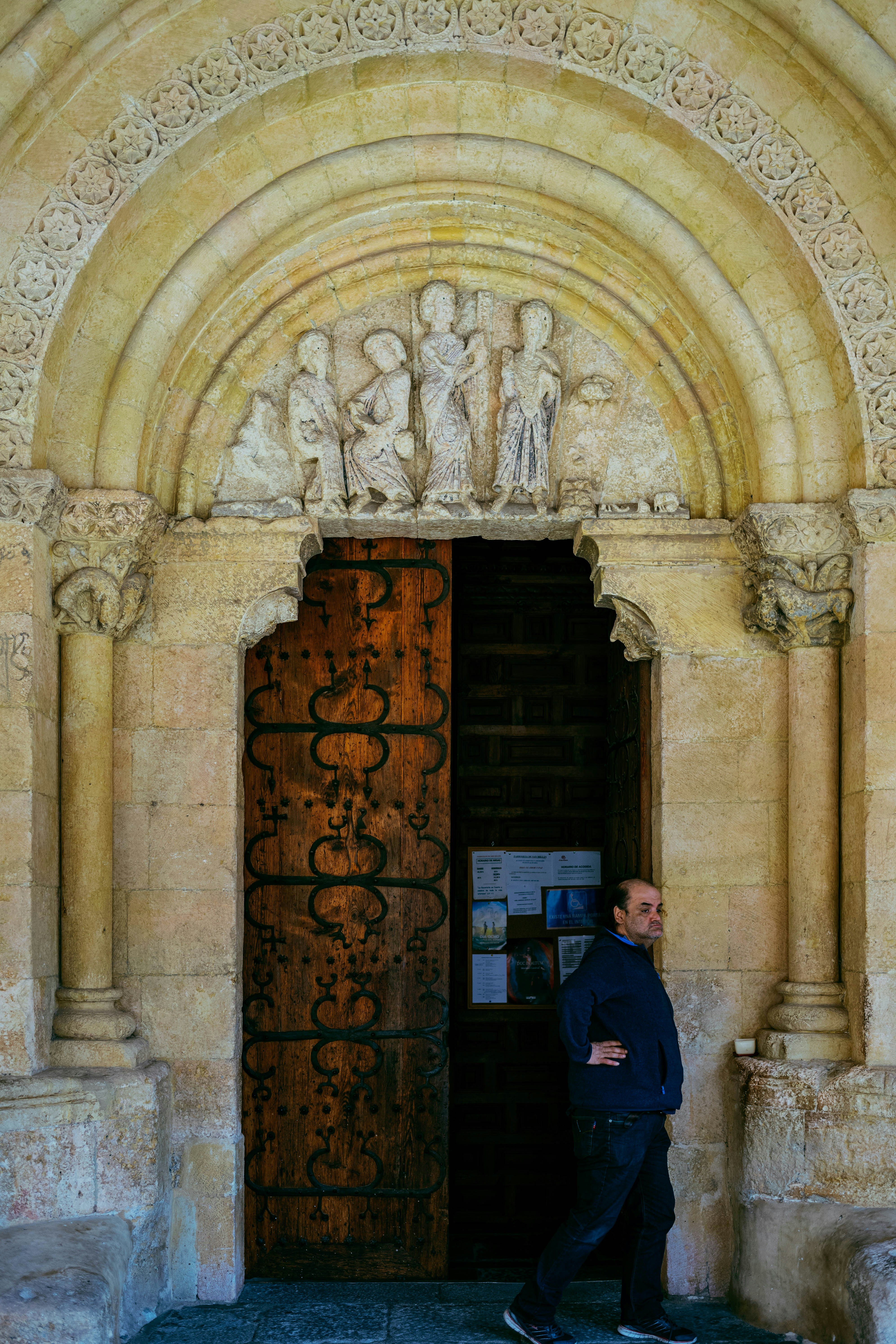 Ancient Portal and Traveler: A Quiet Moment at the Stone Archway