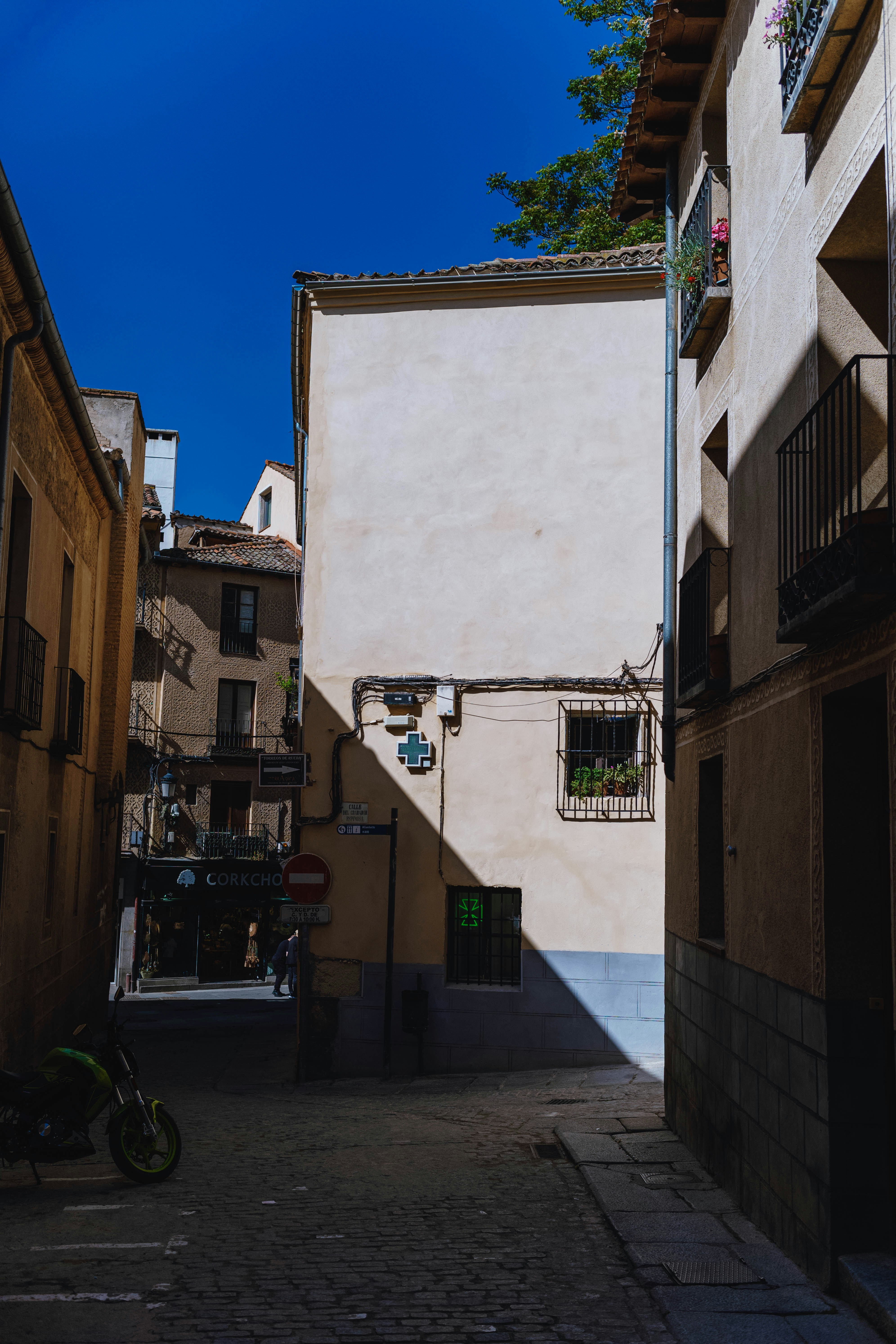 Sunlit Calle of Bare Facades