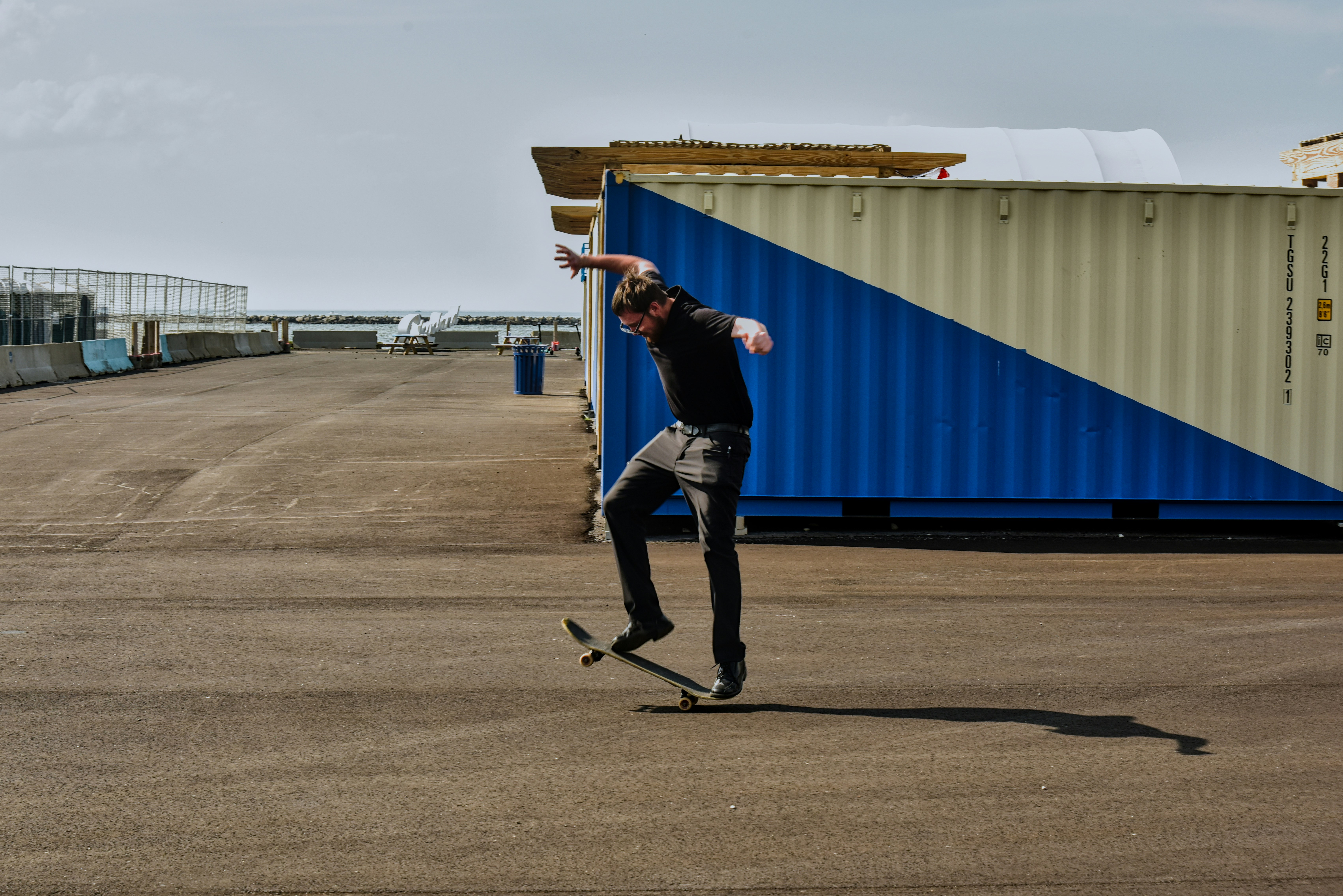 Skater in Motion at an Open Dockyard
