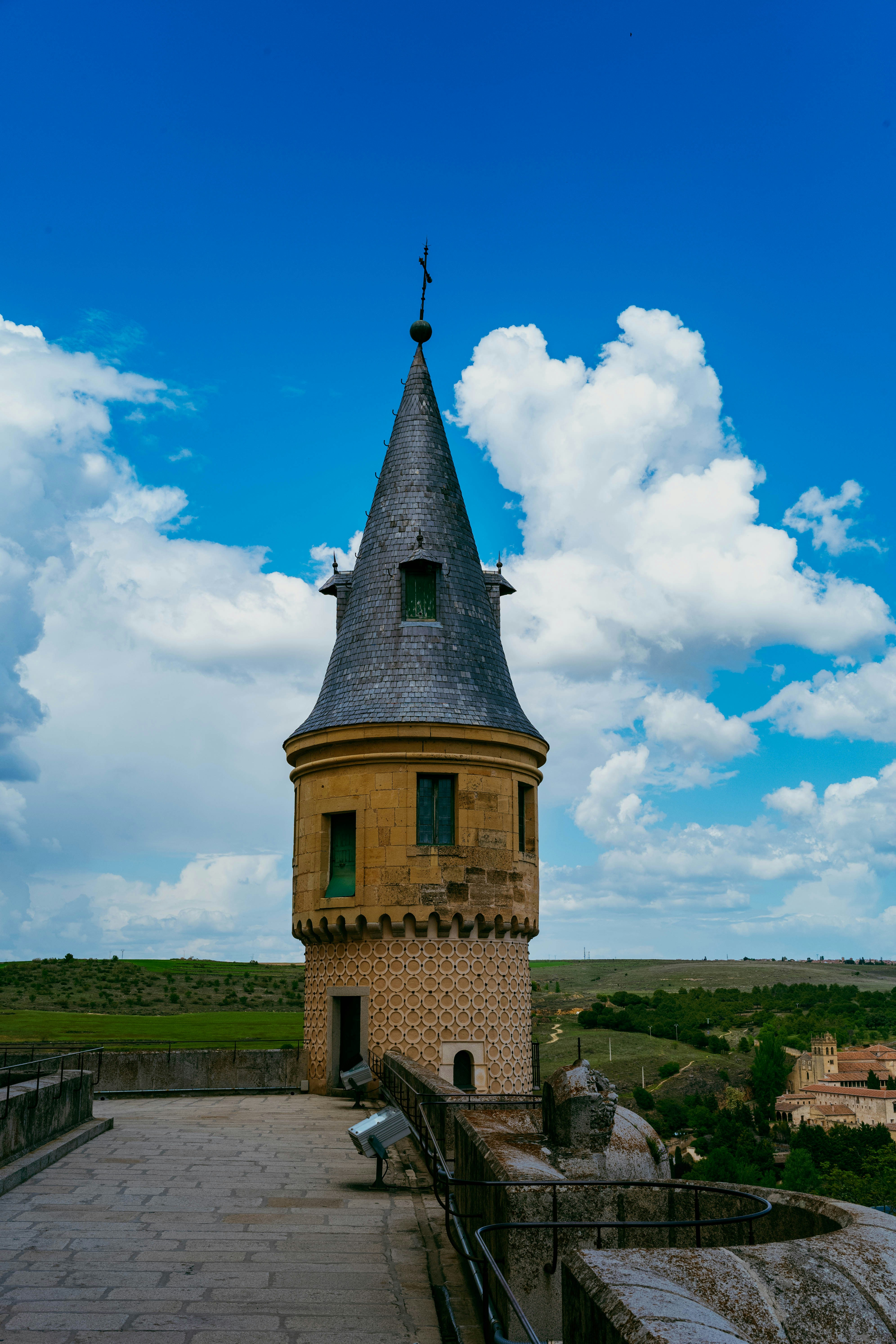 The Turreted Watchtower Under a Vast Blue Sky