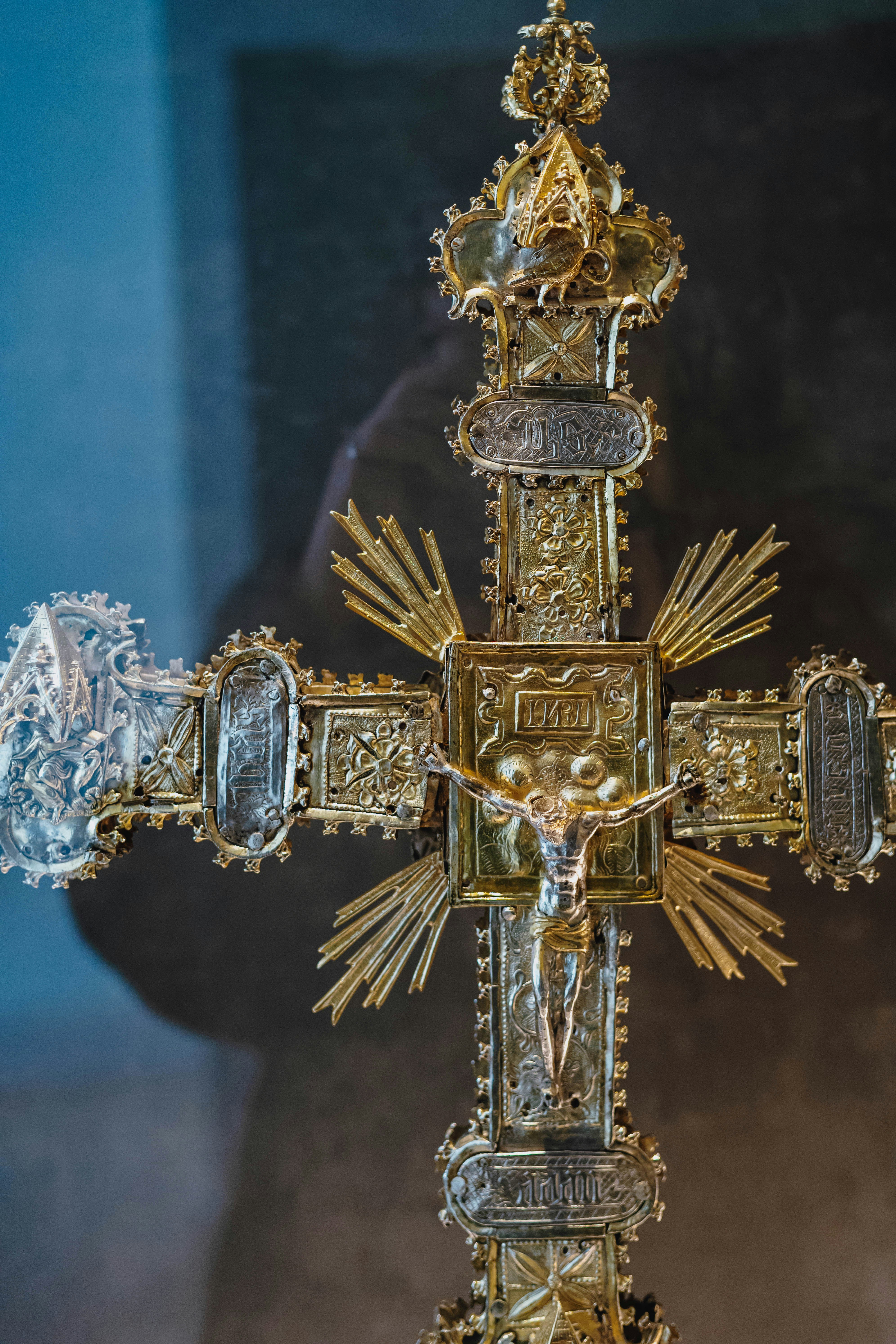 Gilded Sacred Cross: A Dance of Metal and Light