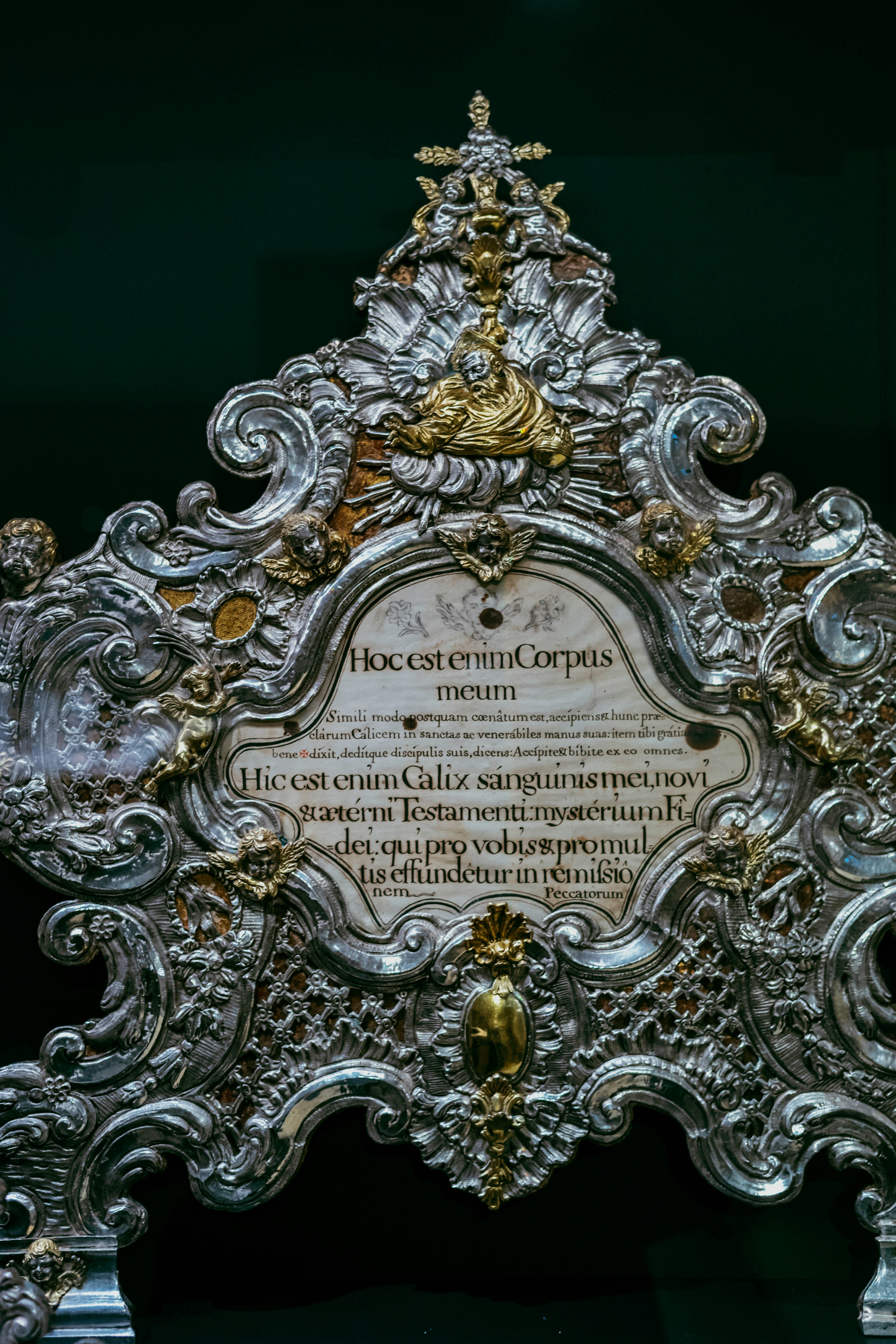 Ornate Baroque Tableau: A Silvered Relief Frame with Central Inscription