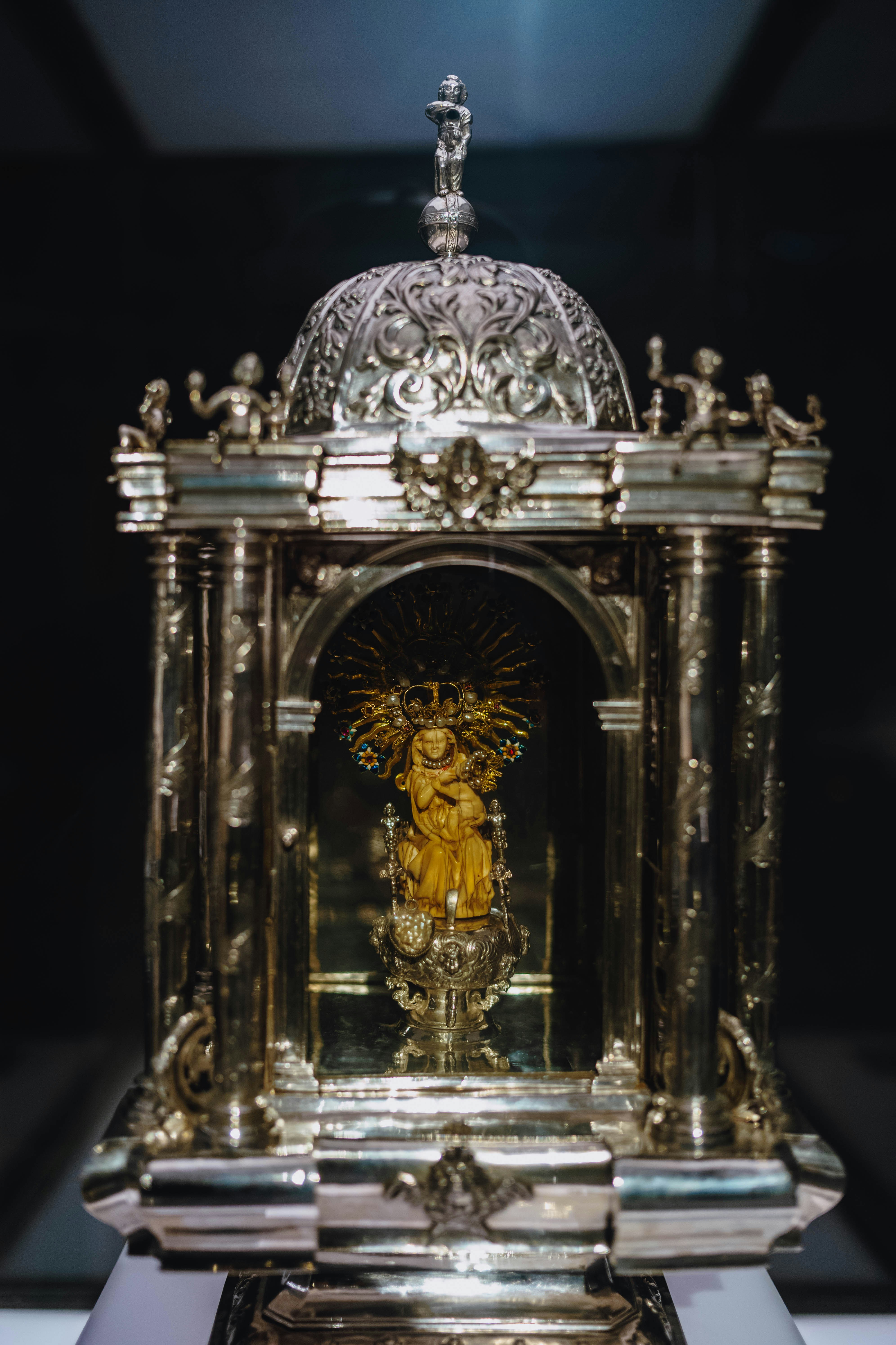 Ornate Reliquary: A gilded shrine housing a sacred figure