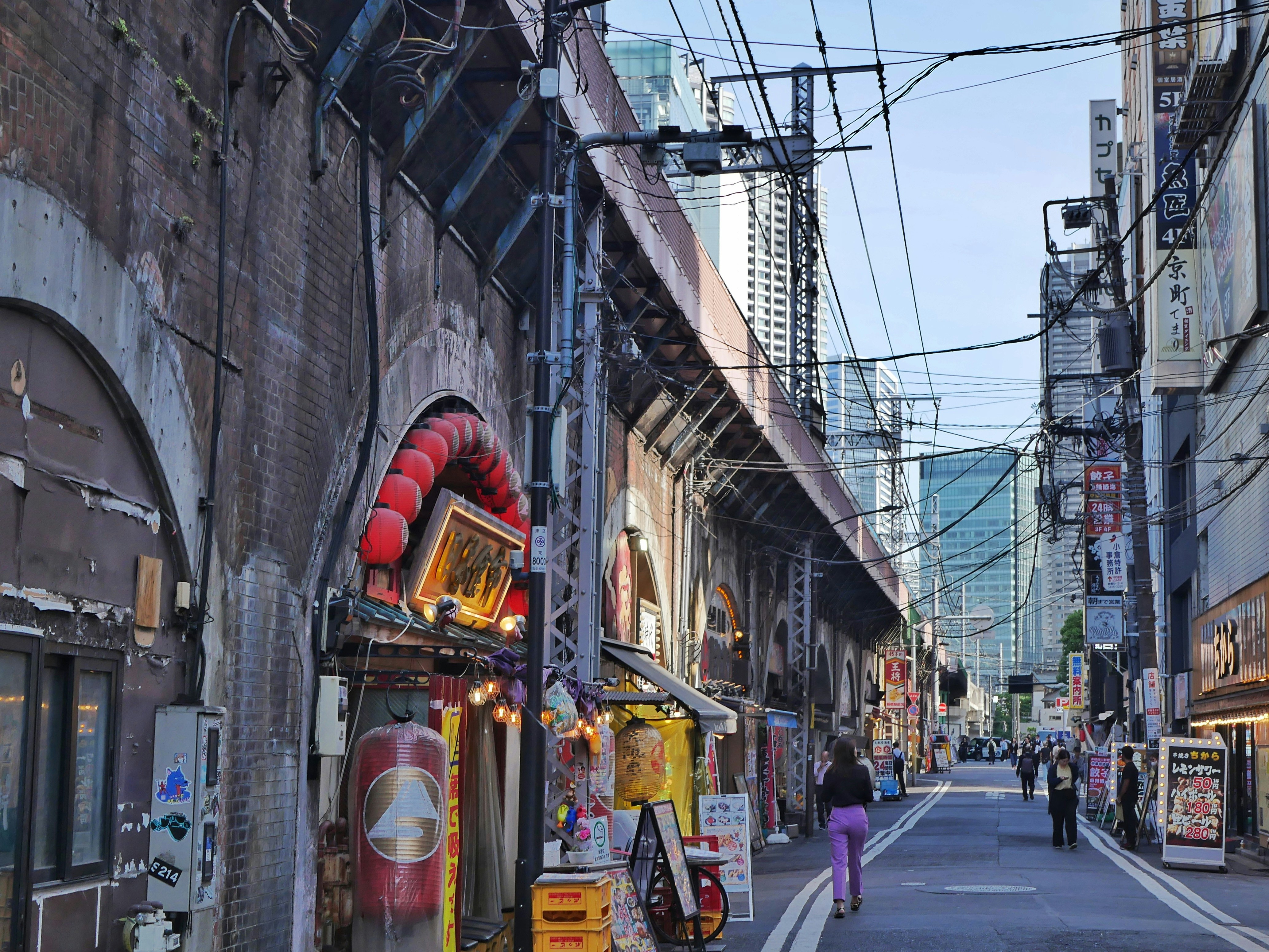 Neon Alleyway: A Parallel Street Scene Under a Tangled Network of Wires