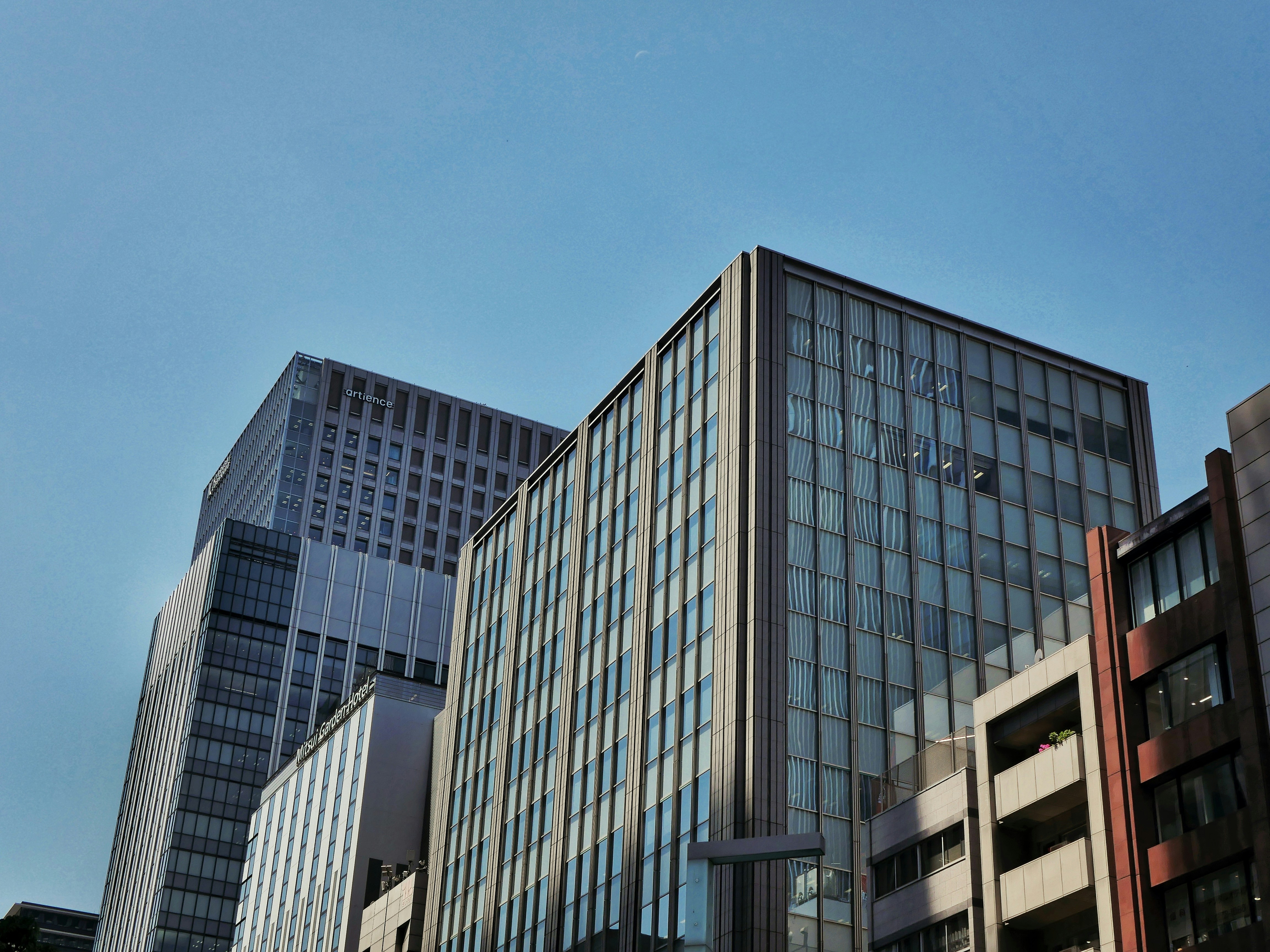 Cityscape Tilt: Glass and Sky in a Leaning Skyline