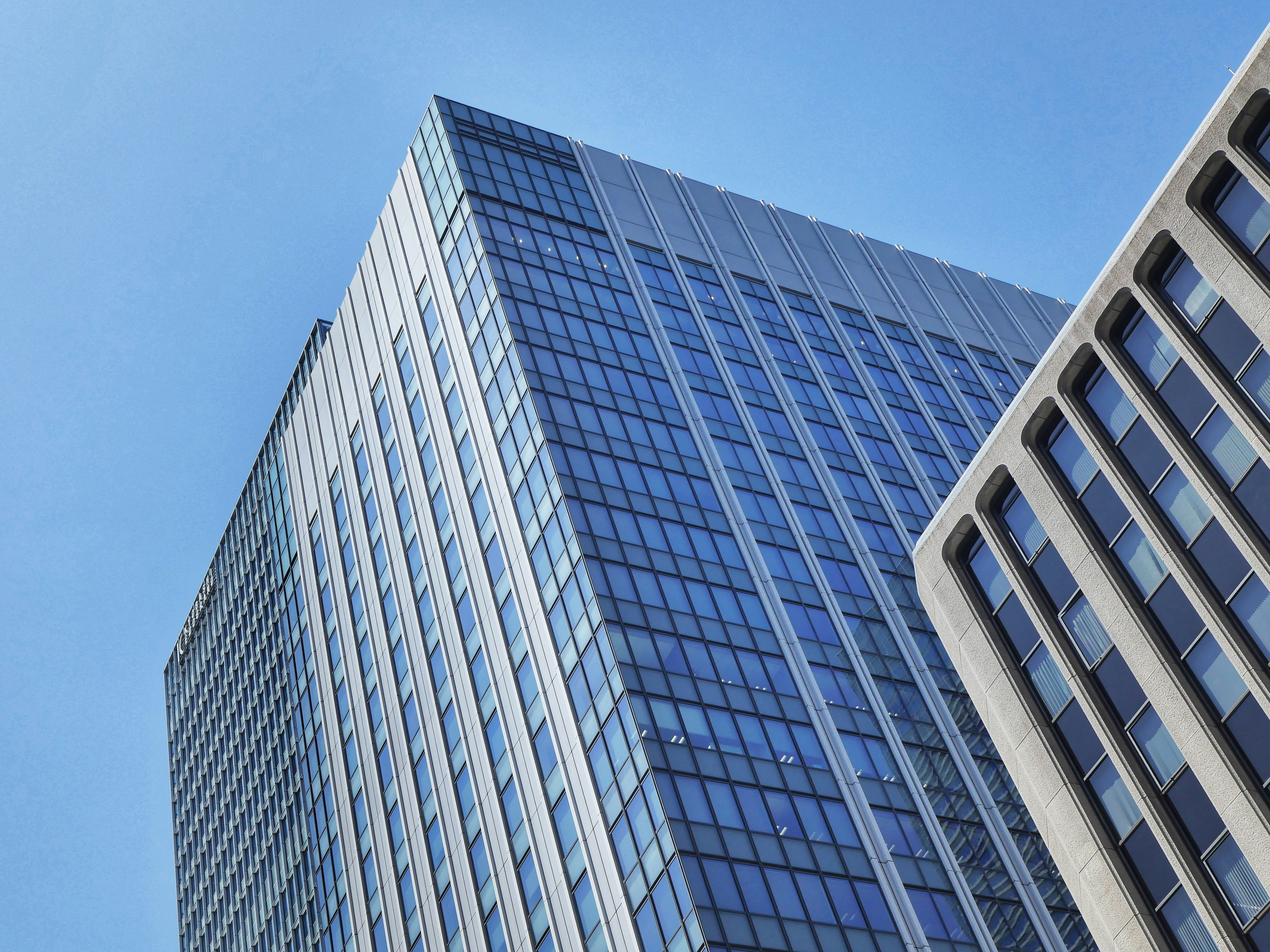 Glass Skyscraper Tilt: A Sharp Horizon of Facade Reflections