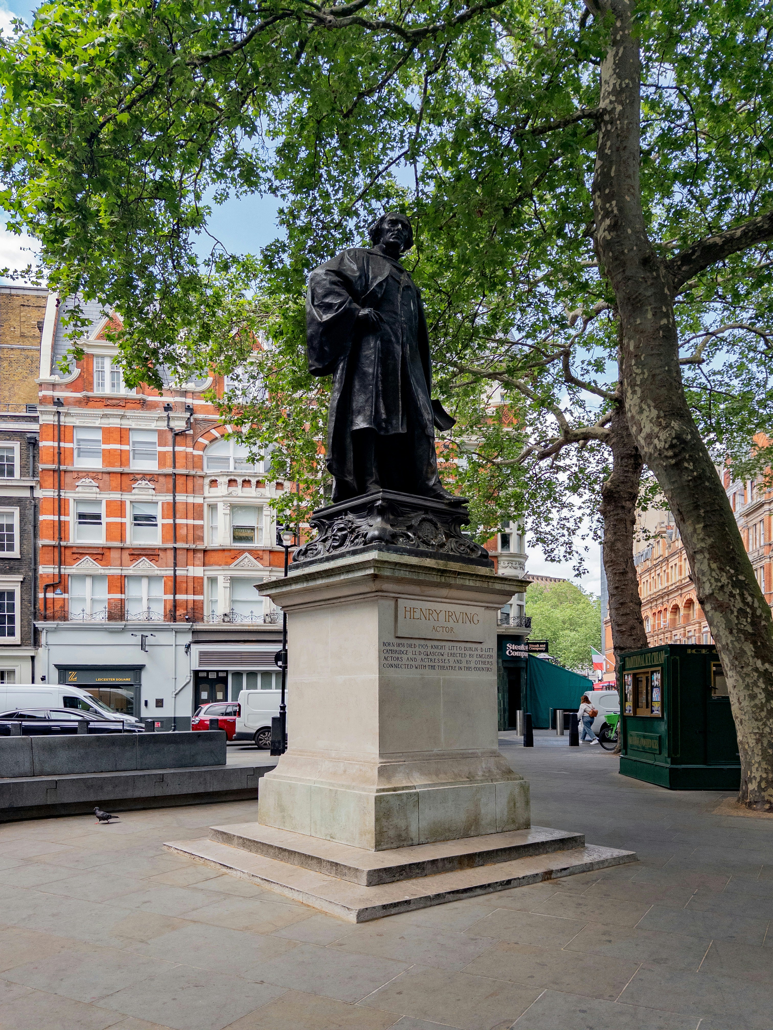 Bronze Statue Rising Over a Stone Pedestal in a City Square