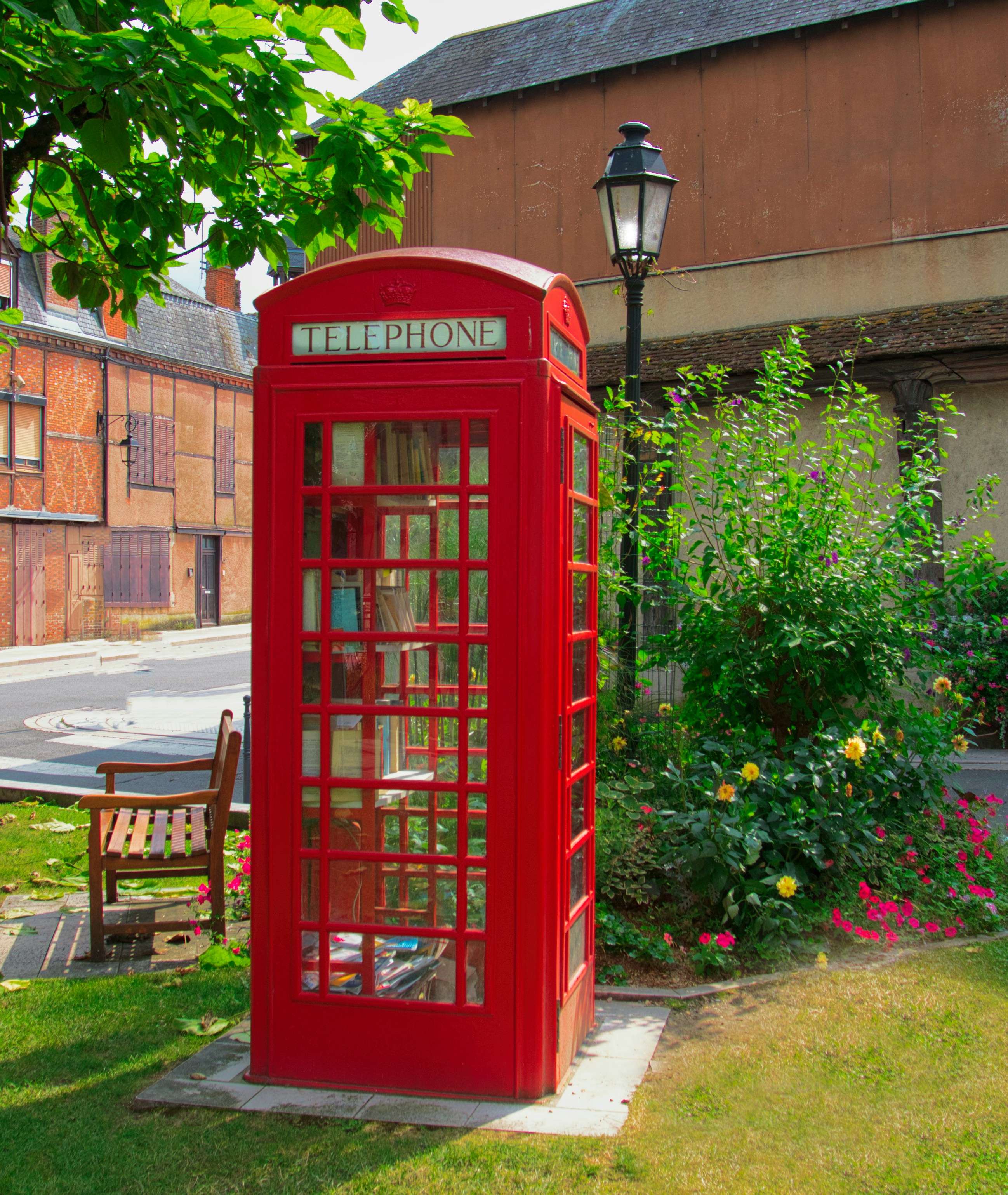 Crimson Kiosk in a Quiet Village Scene