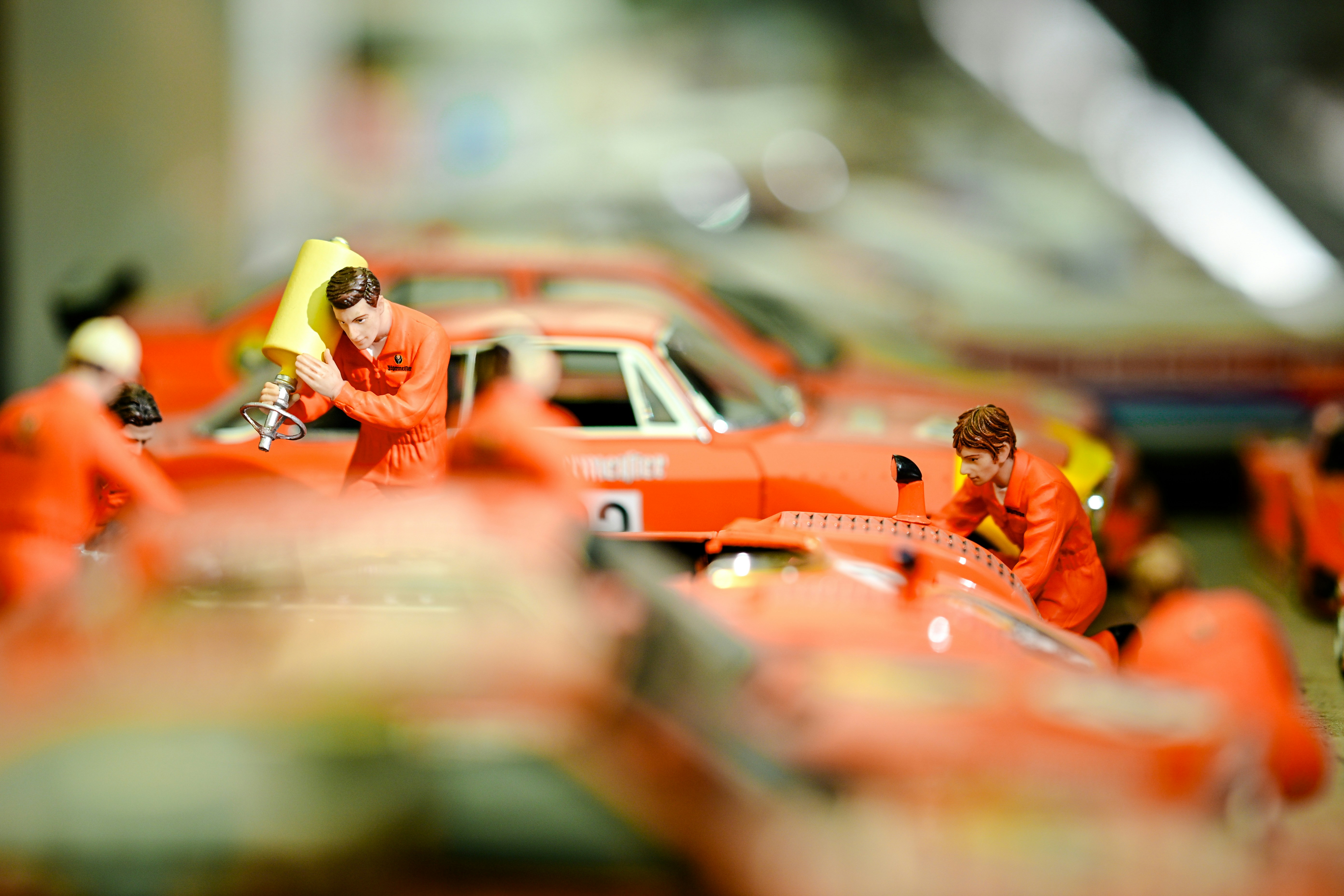 Red Pit Crew in Focus: Hue and Hurry at the Car Workshop