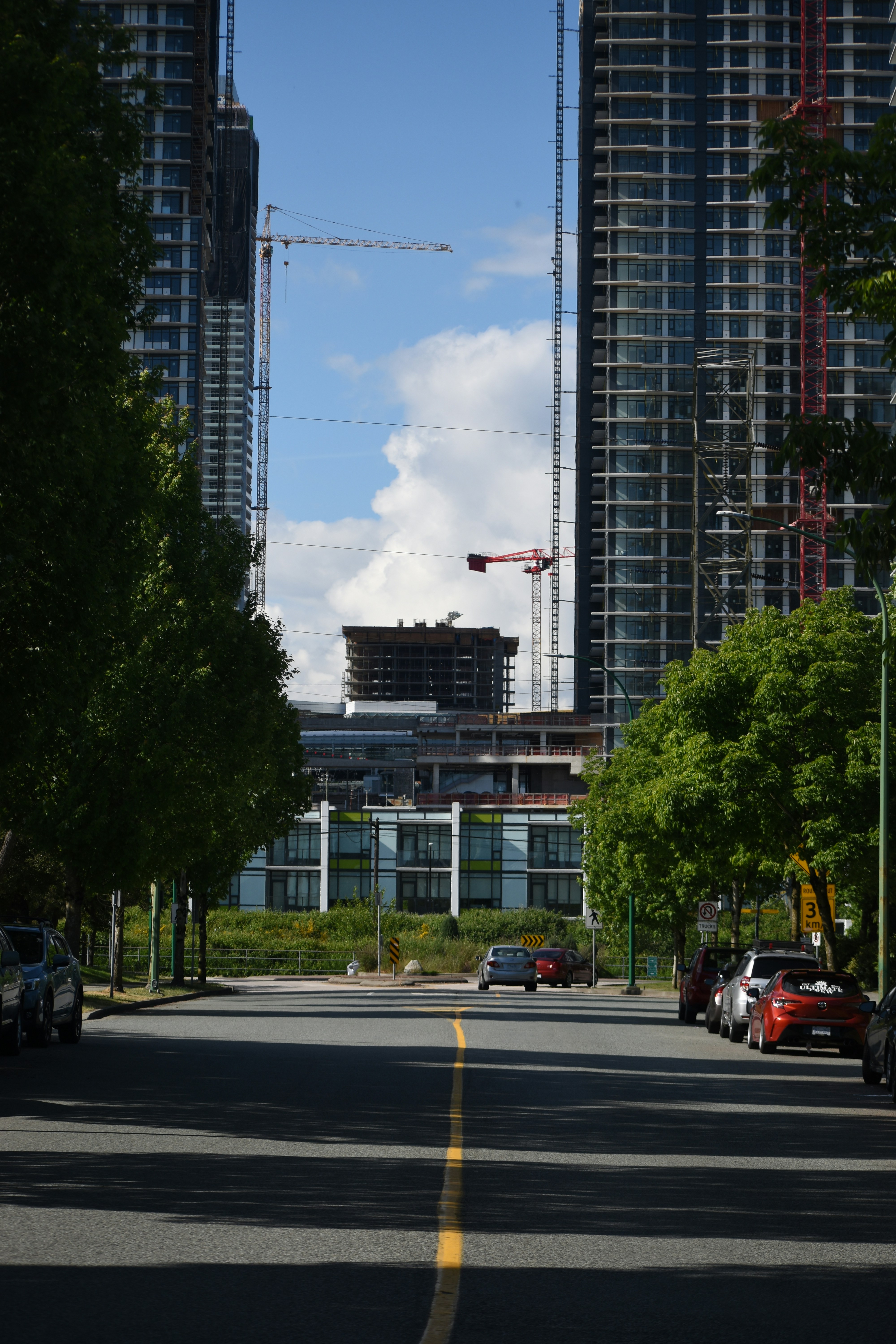 Towering Construction Frames Down a City Street