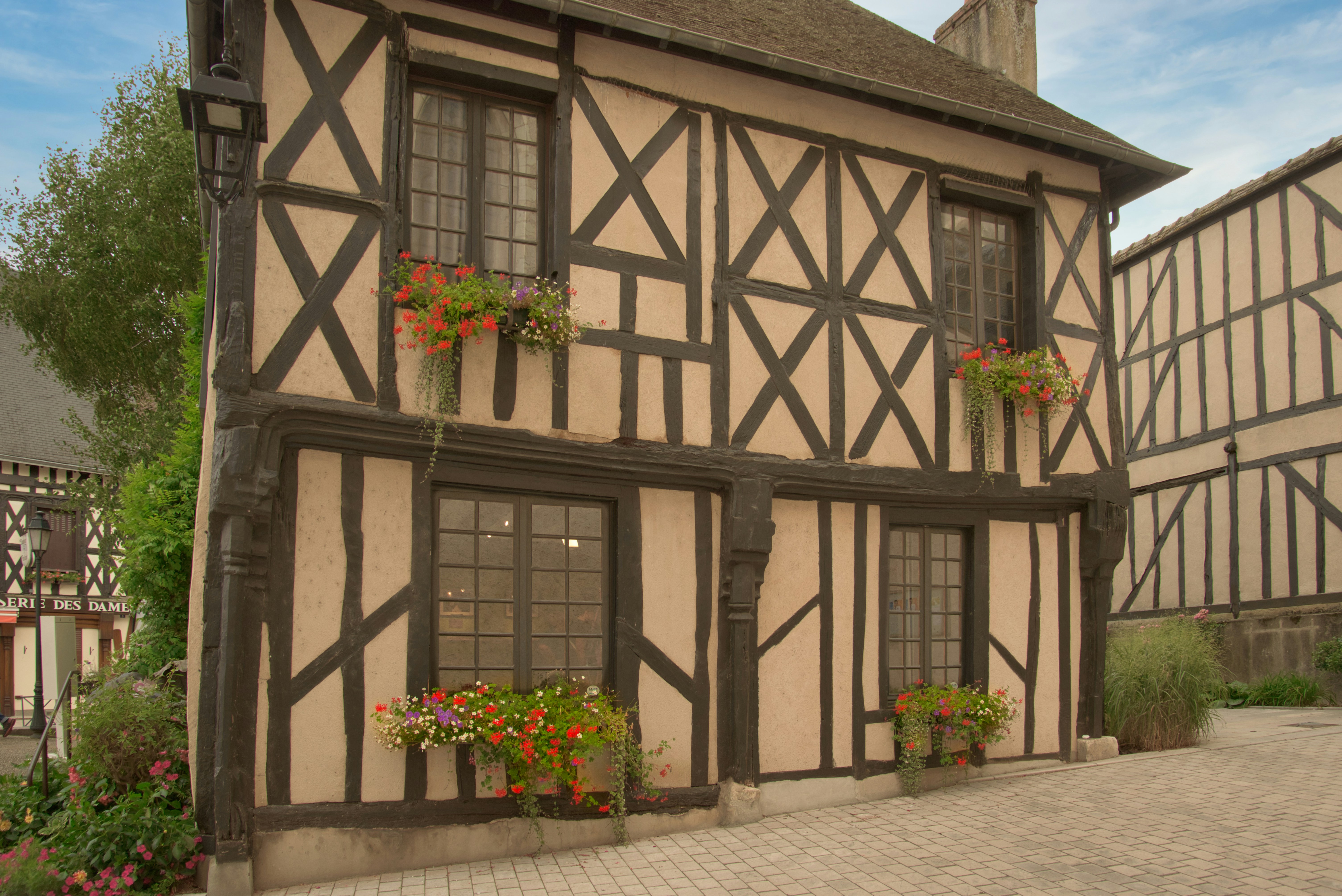 Timbered Facade in Bloom: A Quiet French Village House