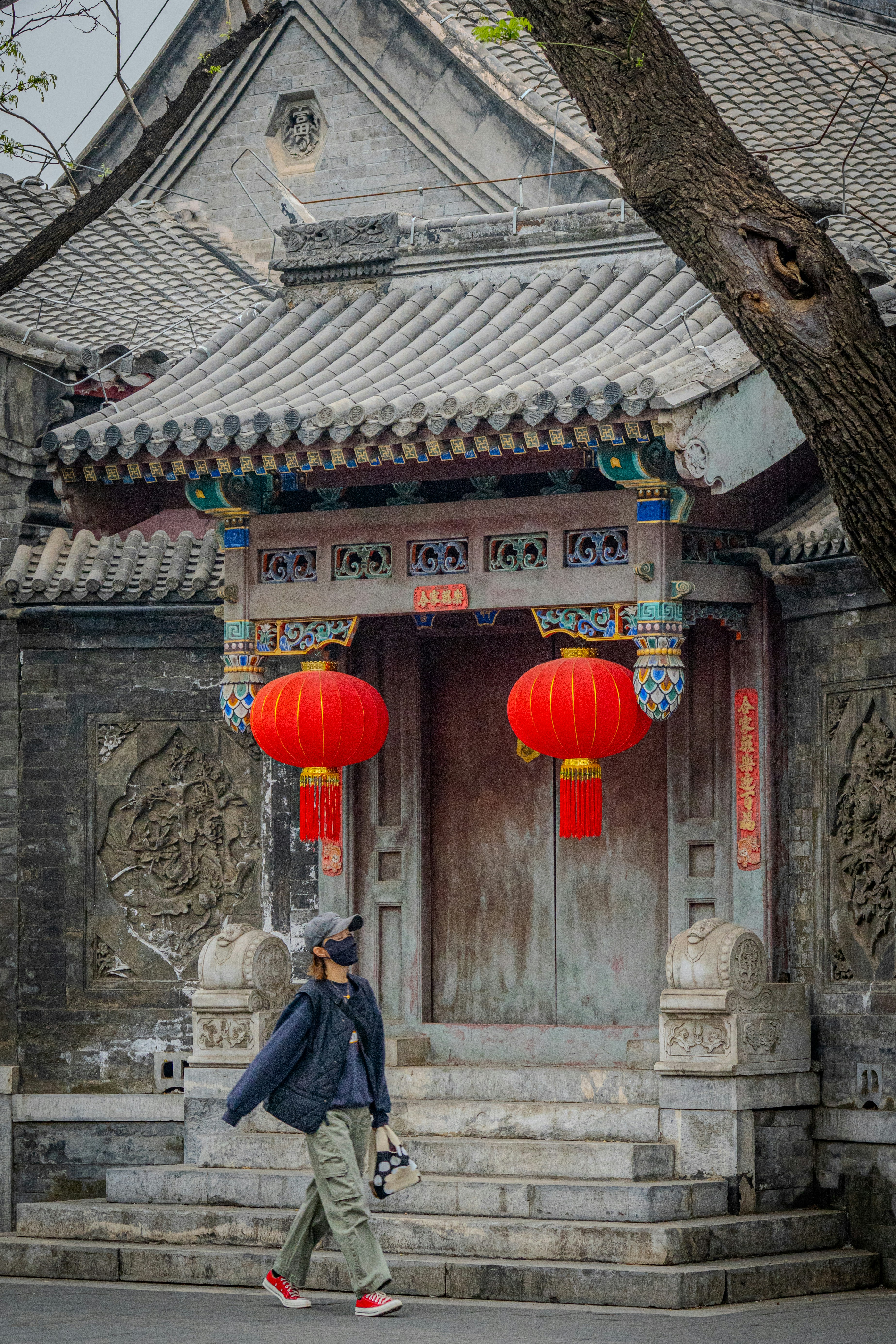 Red Lantern Gatekeeper: A Traveler Pause at the Chinese Courtyard