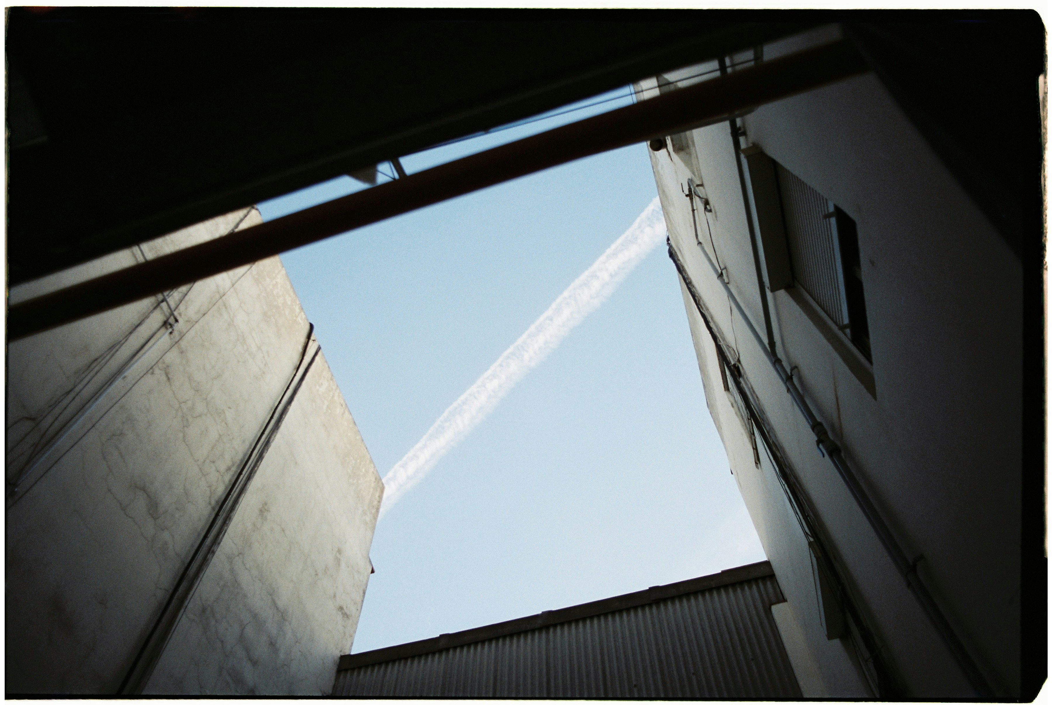 Skyline Gap: A Tilted Moment Between Walls