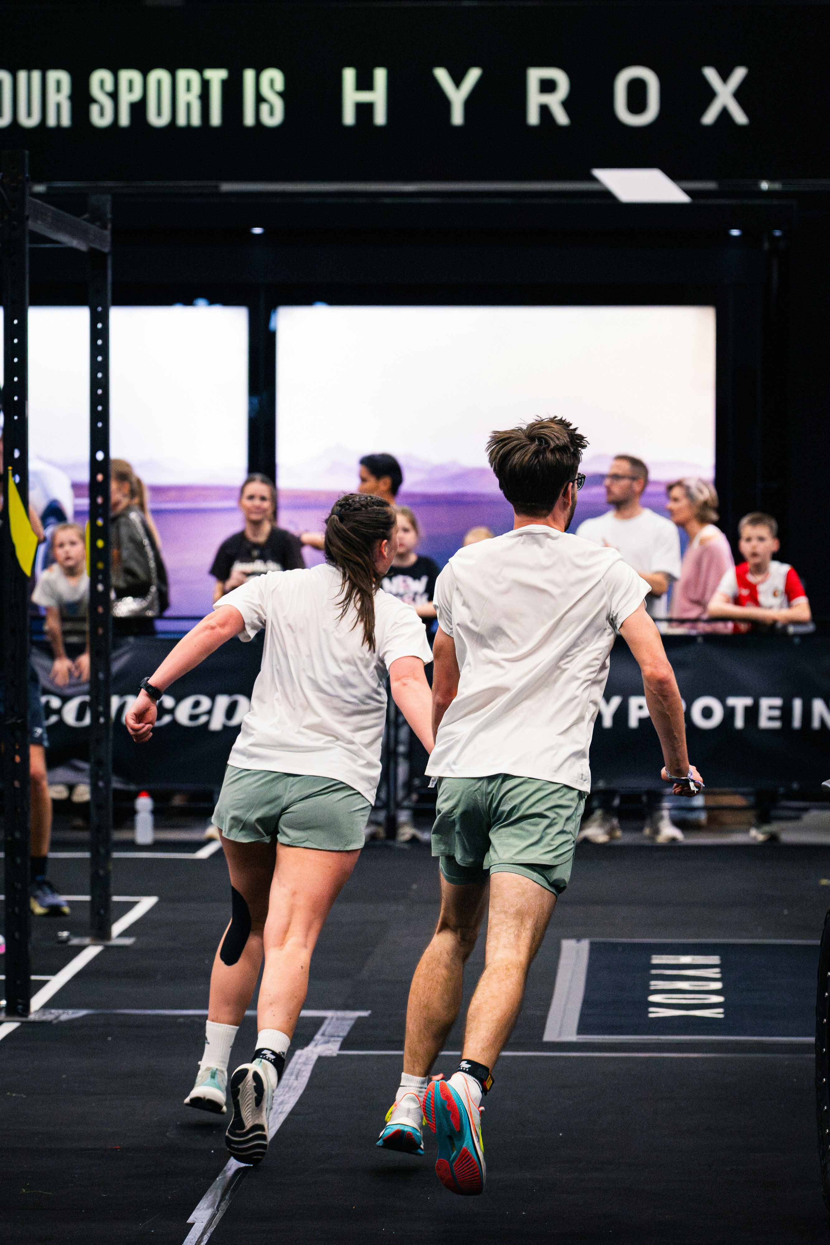 Runners in Sync: Duo Propel Toward the Finish Line