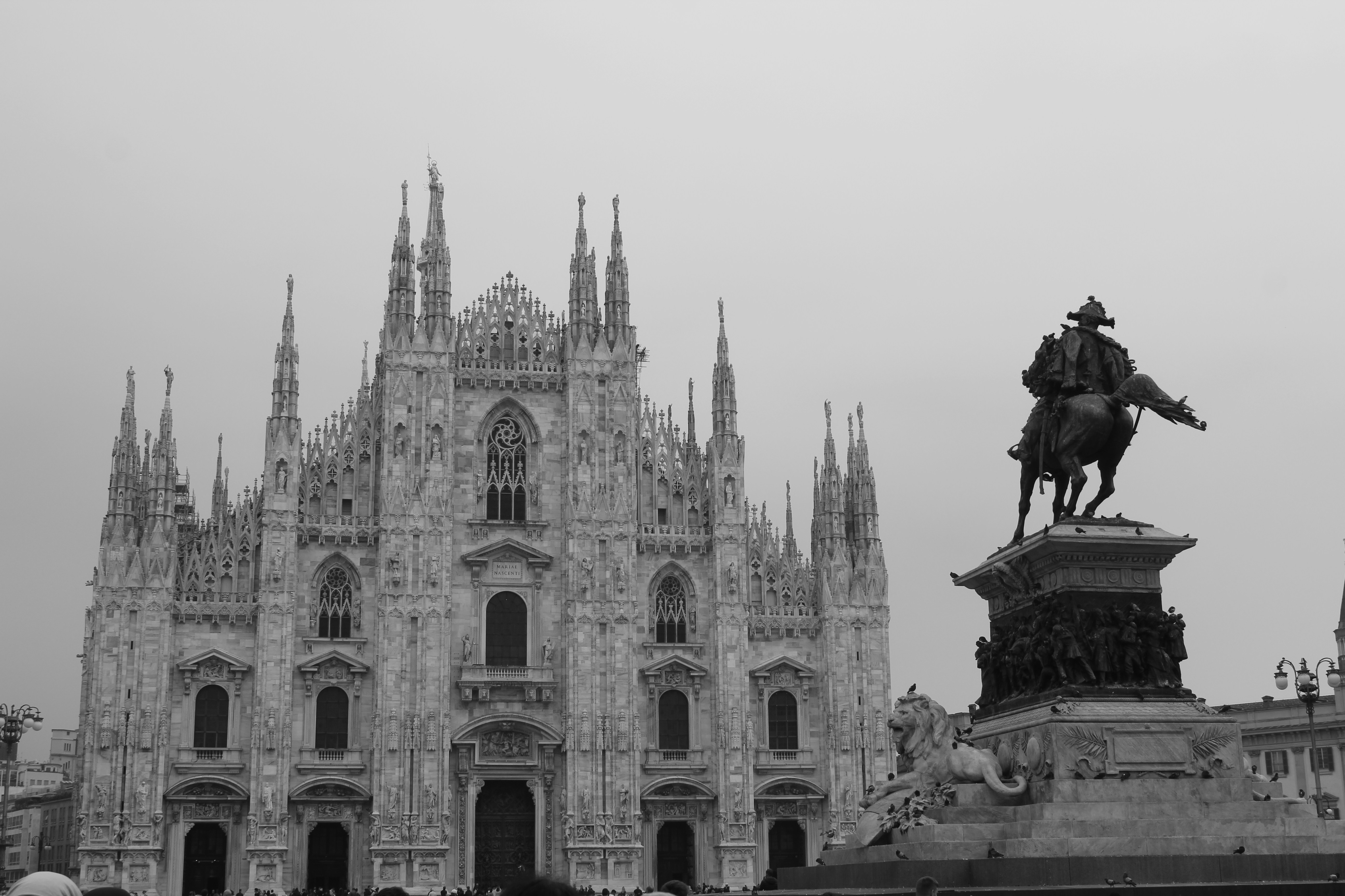 Majestic Milan Cathedral and bronze horseman silhouette