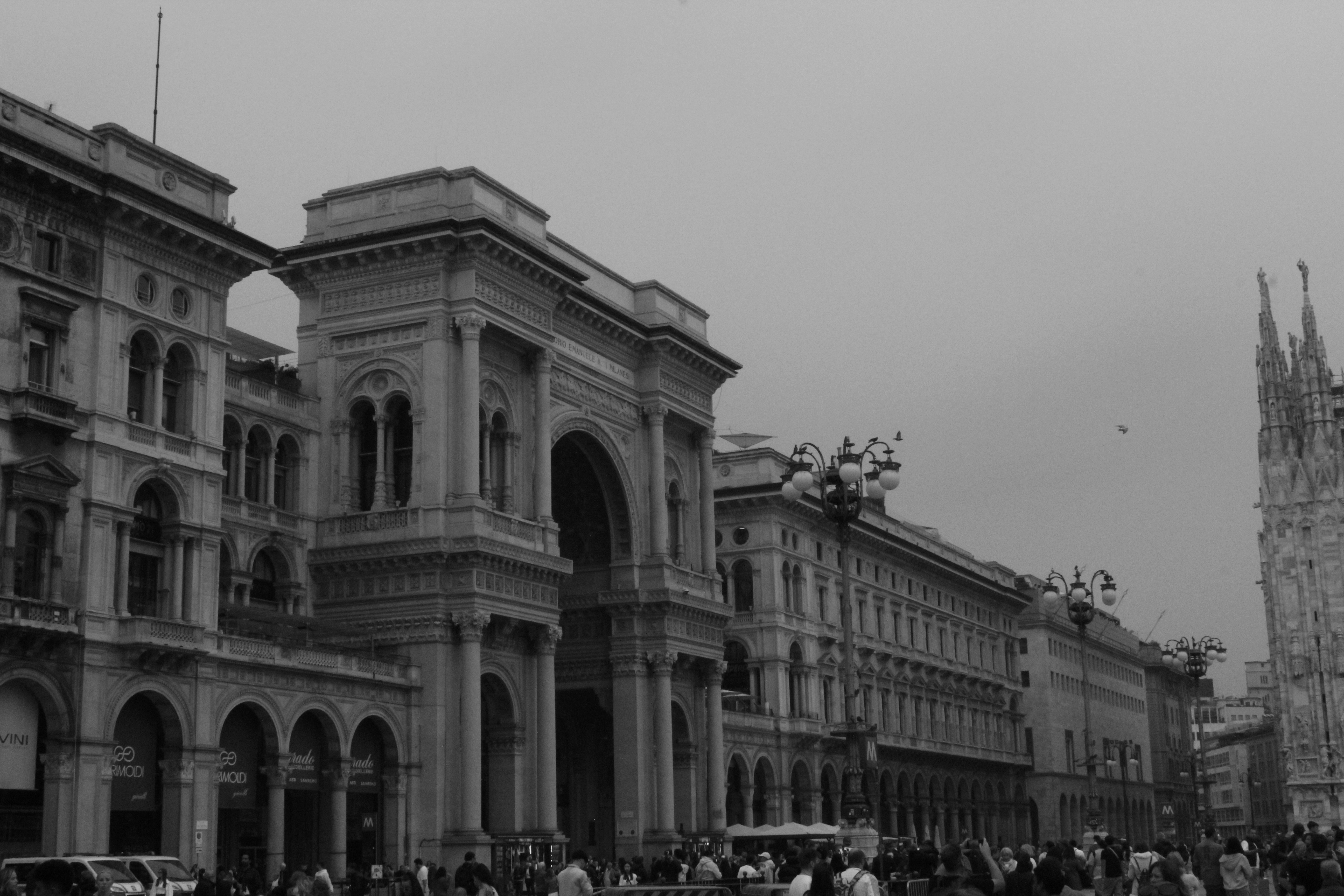 Arcade of Stone and People: Milanese Grandeur in Monochrome