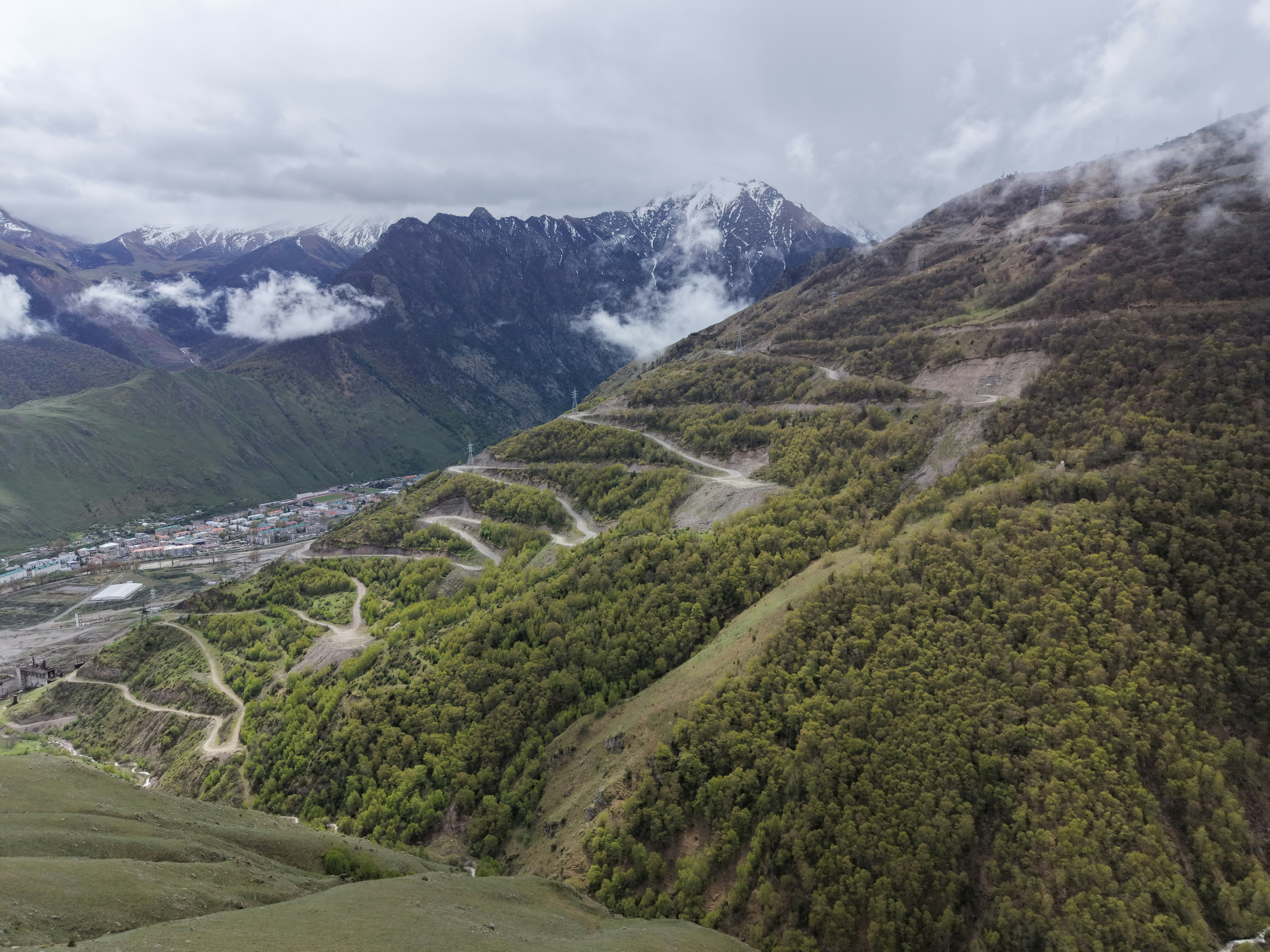 Switchback Mosaic: Mountain Terraces Vanish into the Clouds