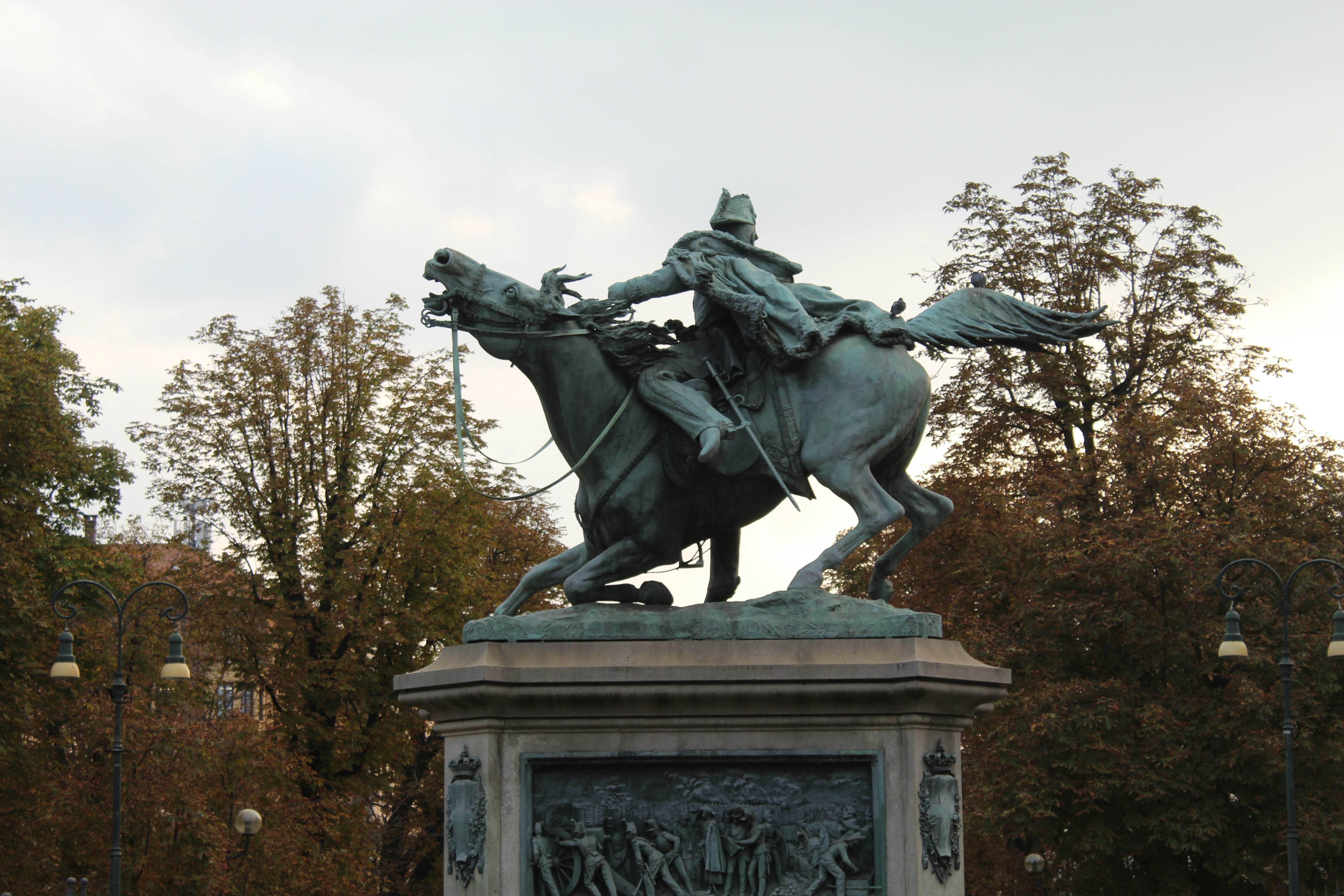 Guardians in Bronze: A Rider’s Stance Over the City