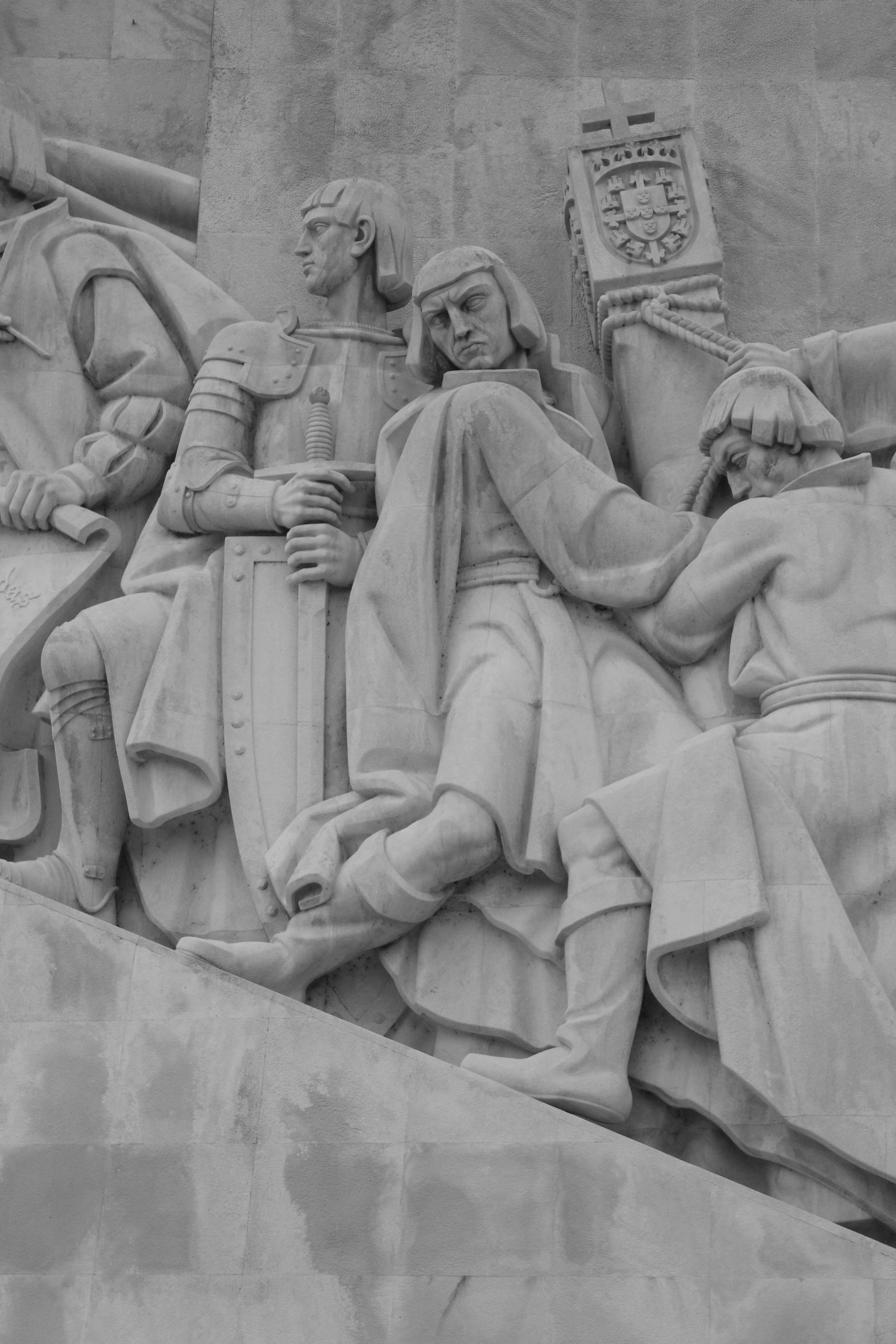 Stone Justice: A towering relief of historical figures in mid-relief