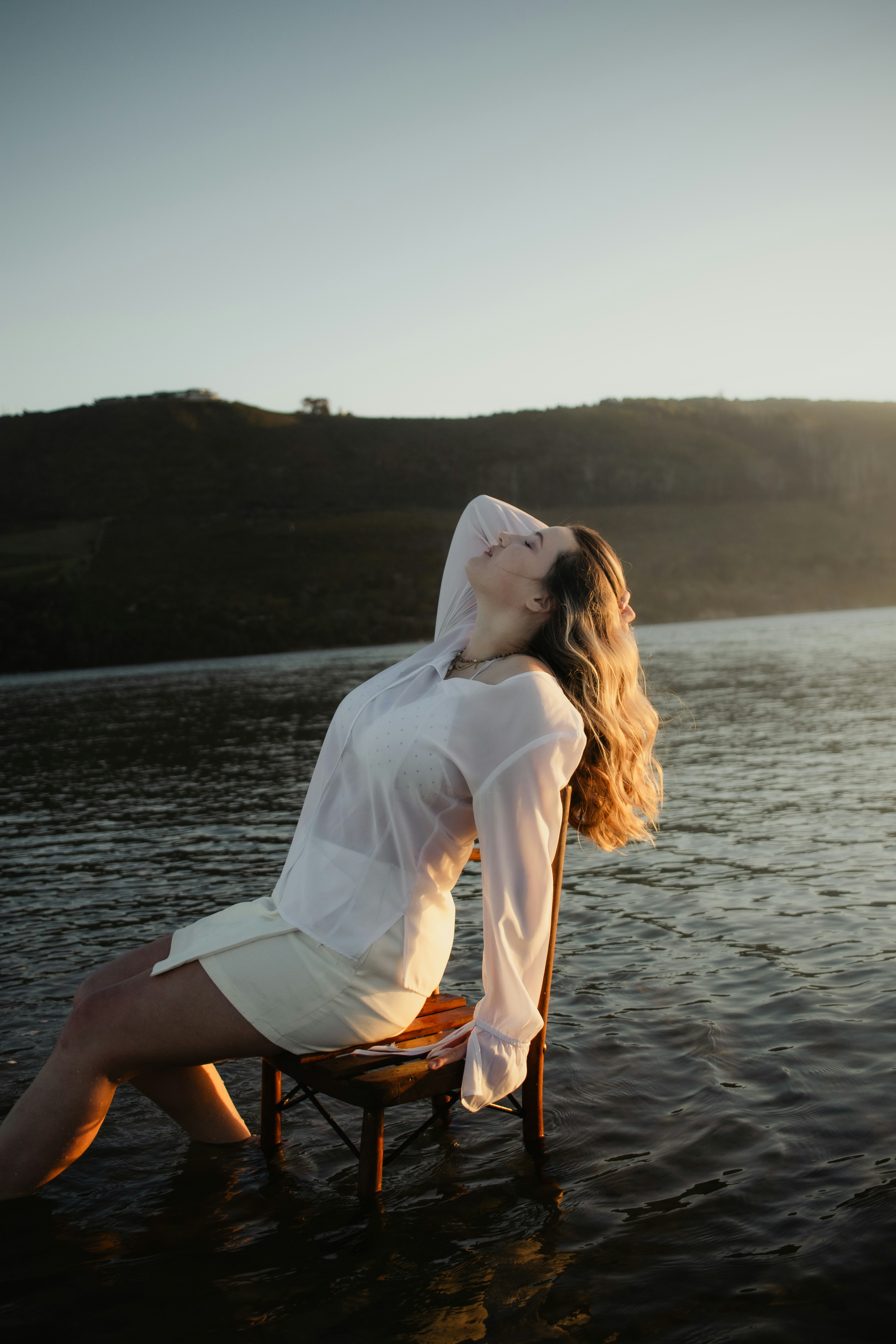 Sunlit Poise: A Moment of Quiet Against the Dusk Lake