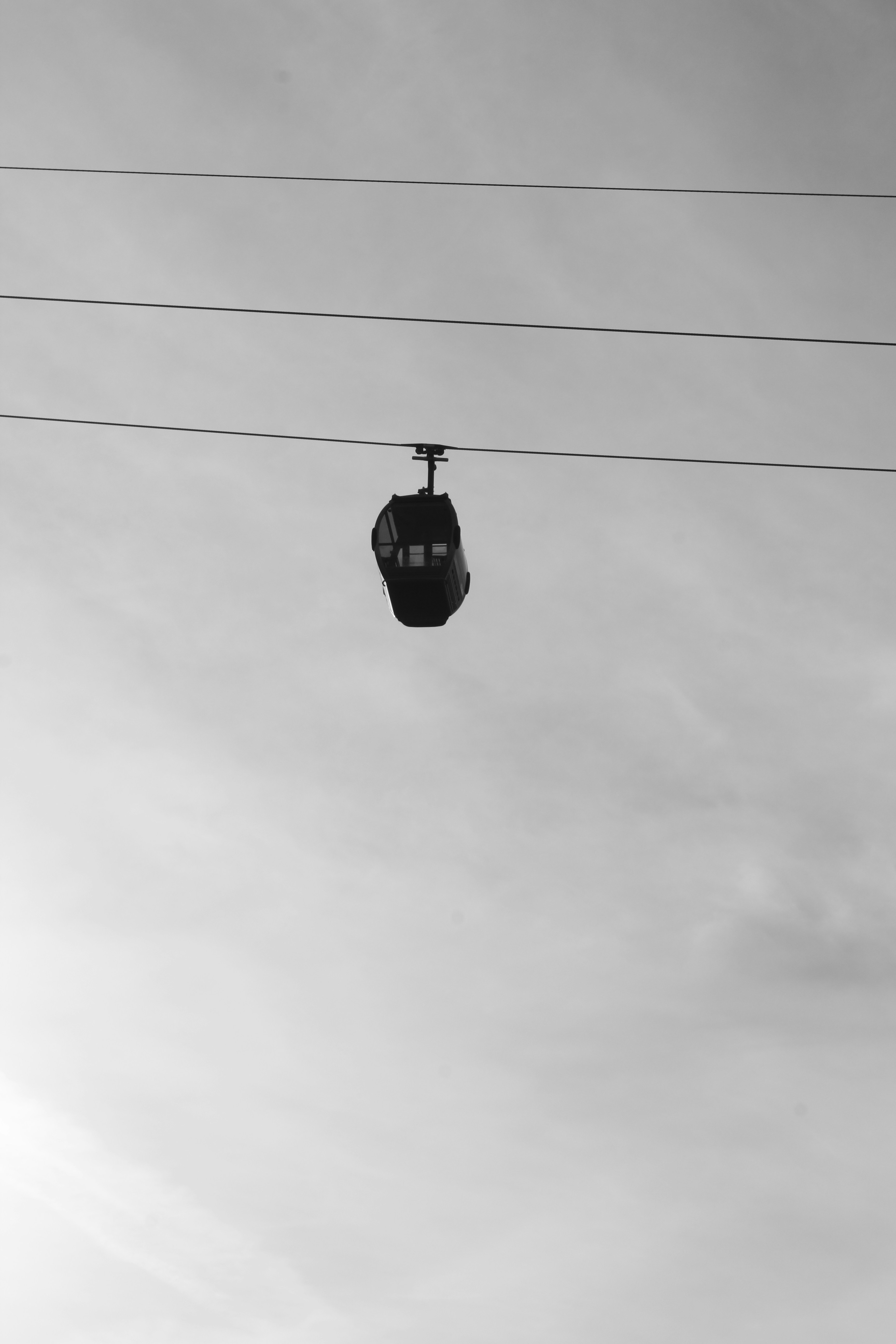 Silent Cable Car Above a Quiet Sky