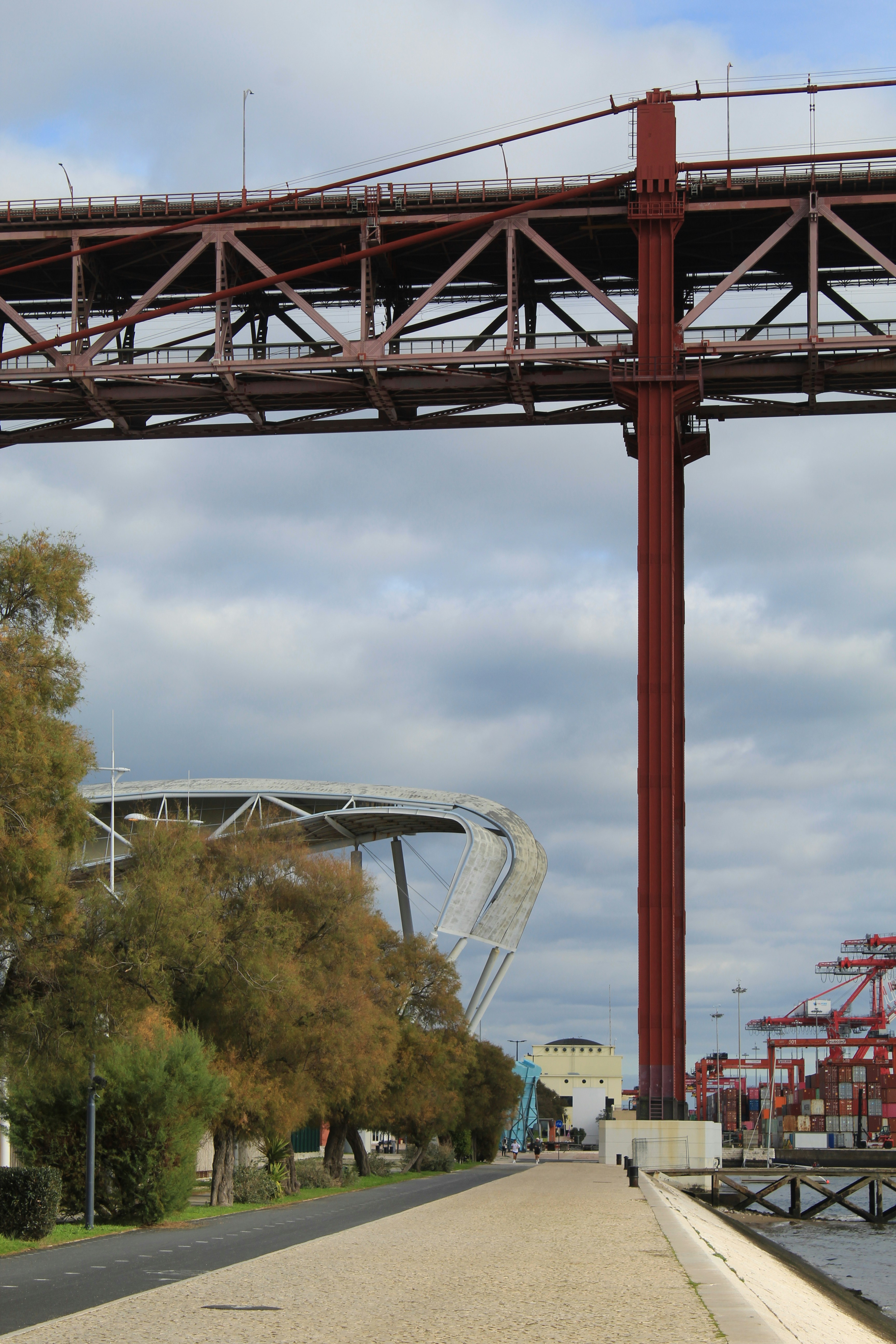 Bridge Horizon: A Quiet Riverside Walk Beneath Steel Giants