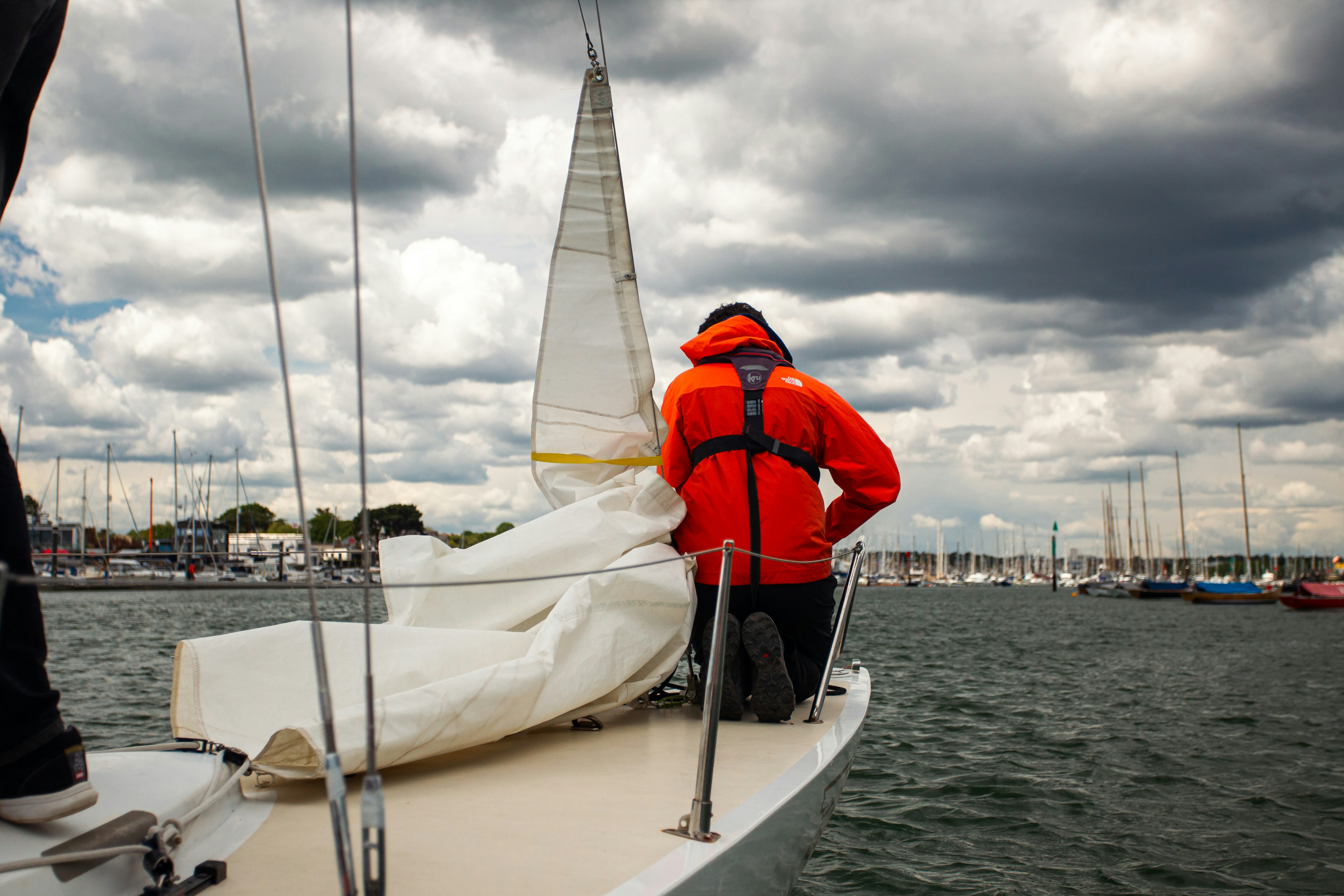 Storm Jacket at the Helm: A Sailor's Focus on the Wind