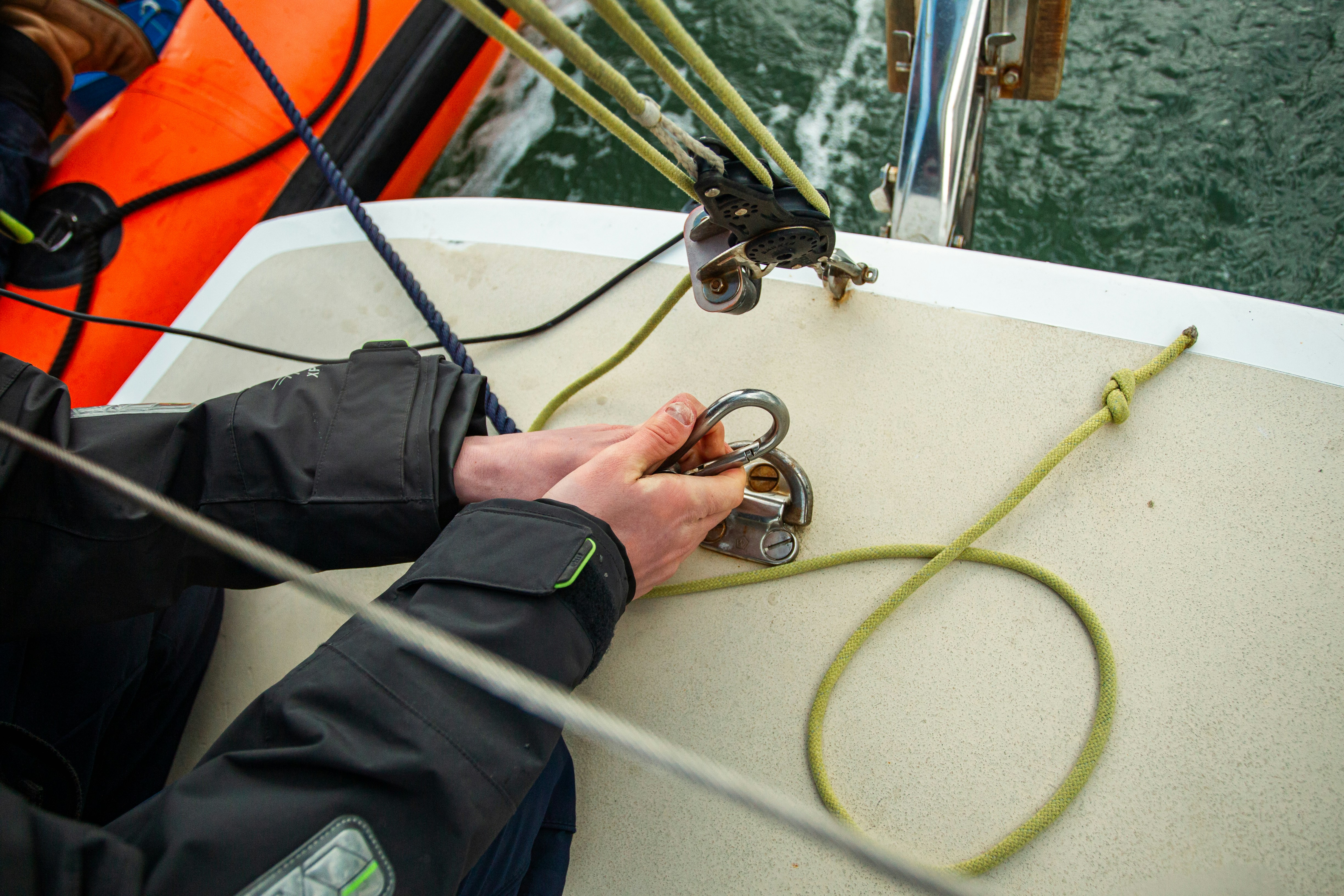 Hands at the Winch: Sailboat Rigging in Focus