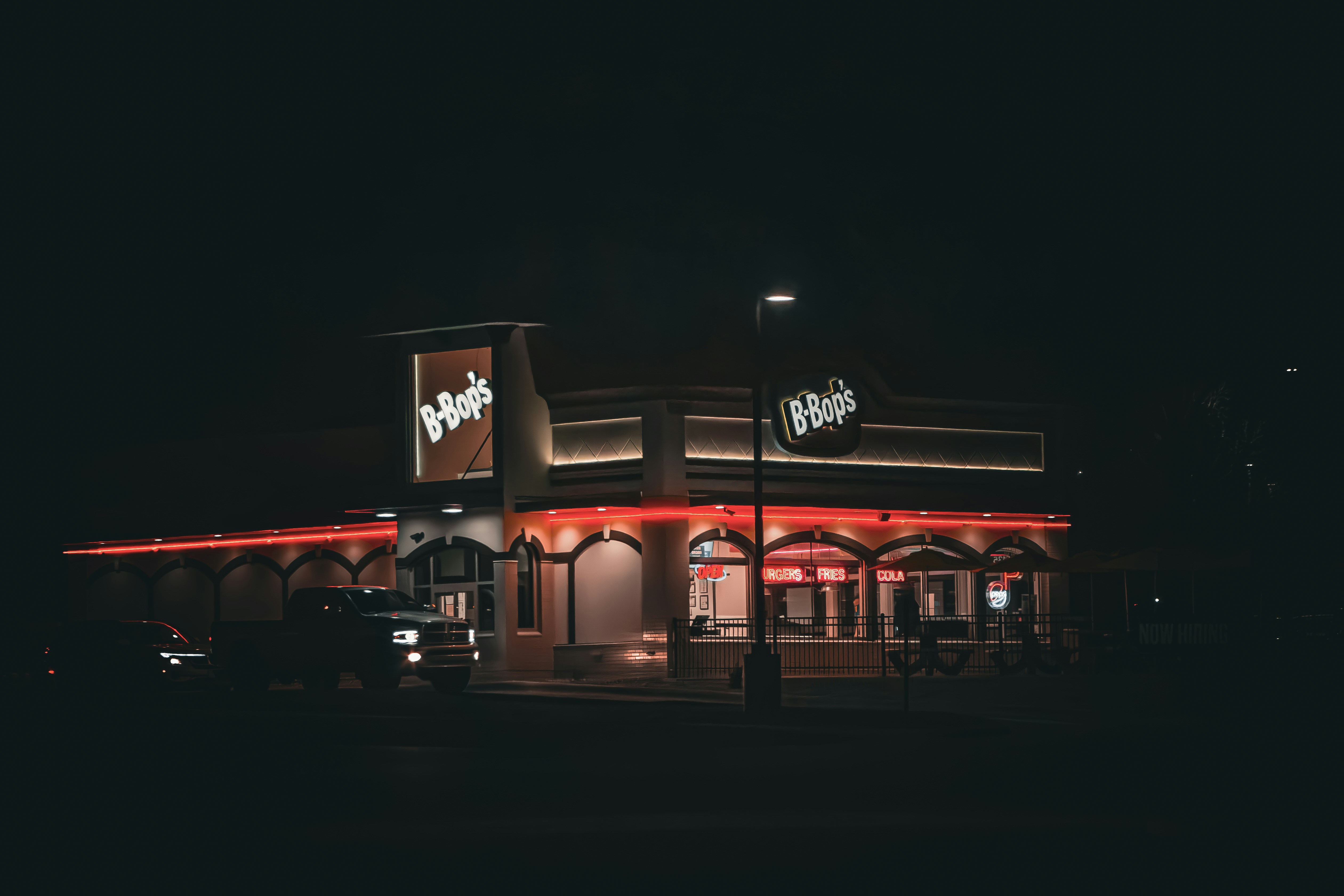 Neon glow on a quiet roadside: Bibo's diner after dark