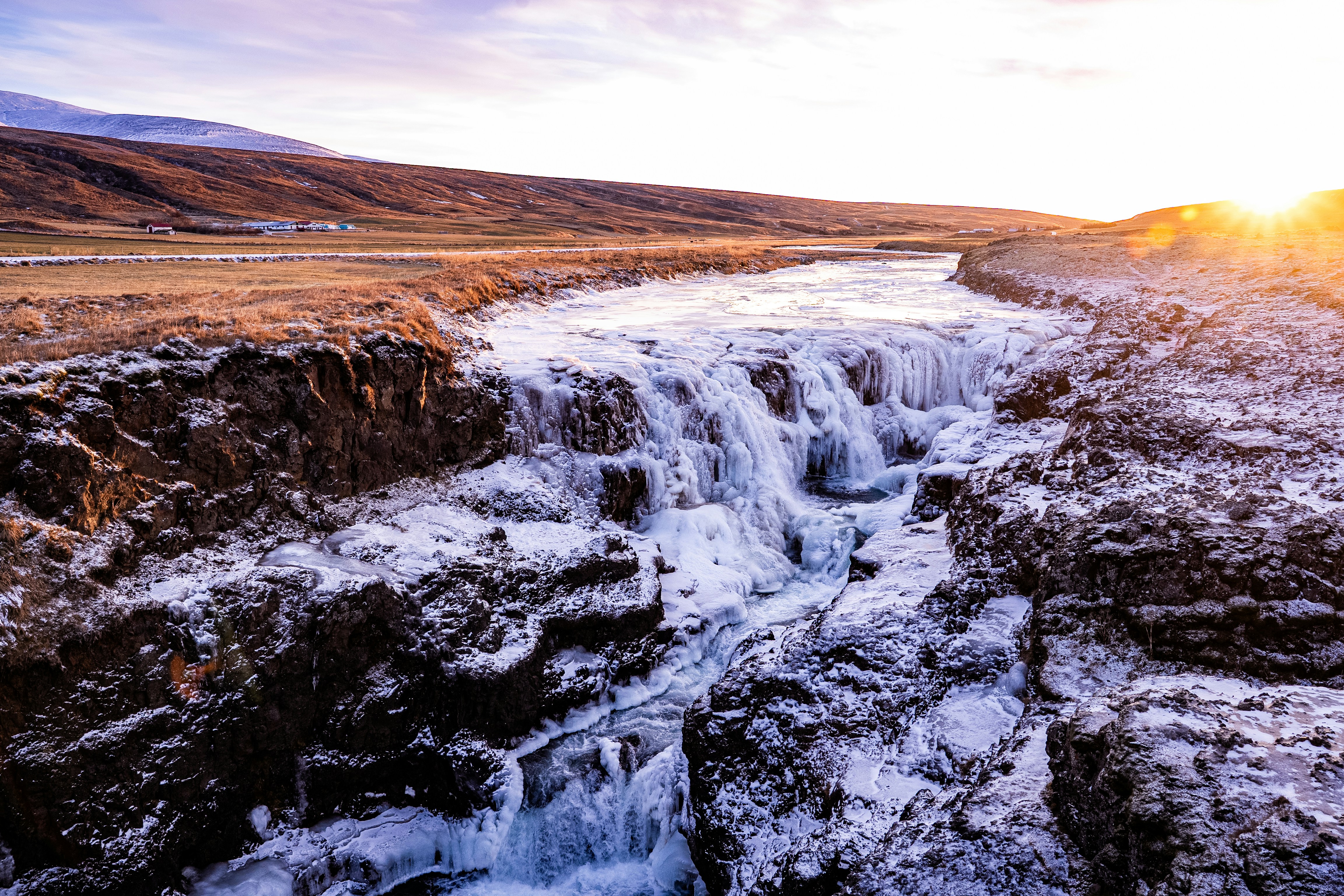 Sunlit Rift: A Snow-Trimmed Canyon Groans Under Golden Light