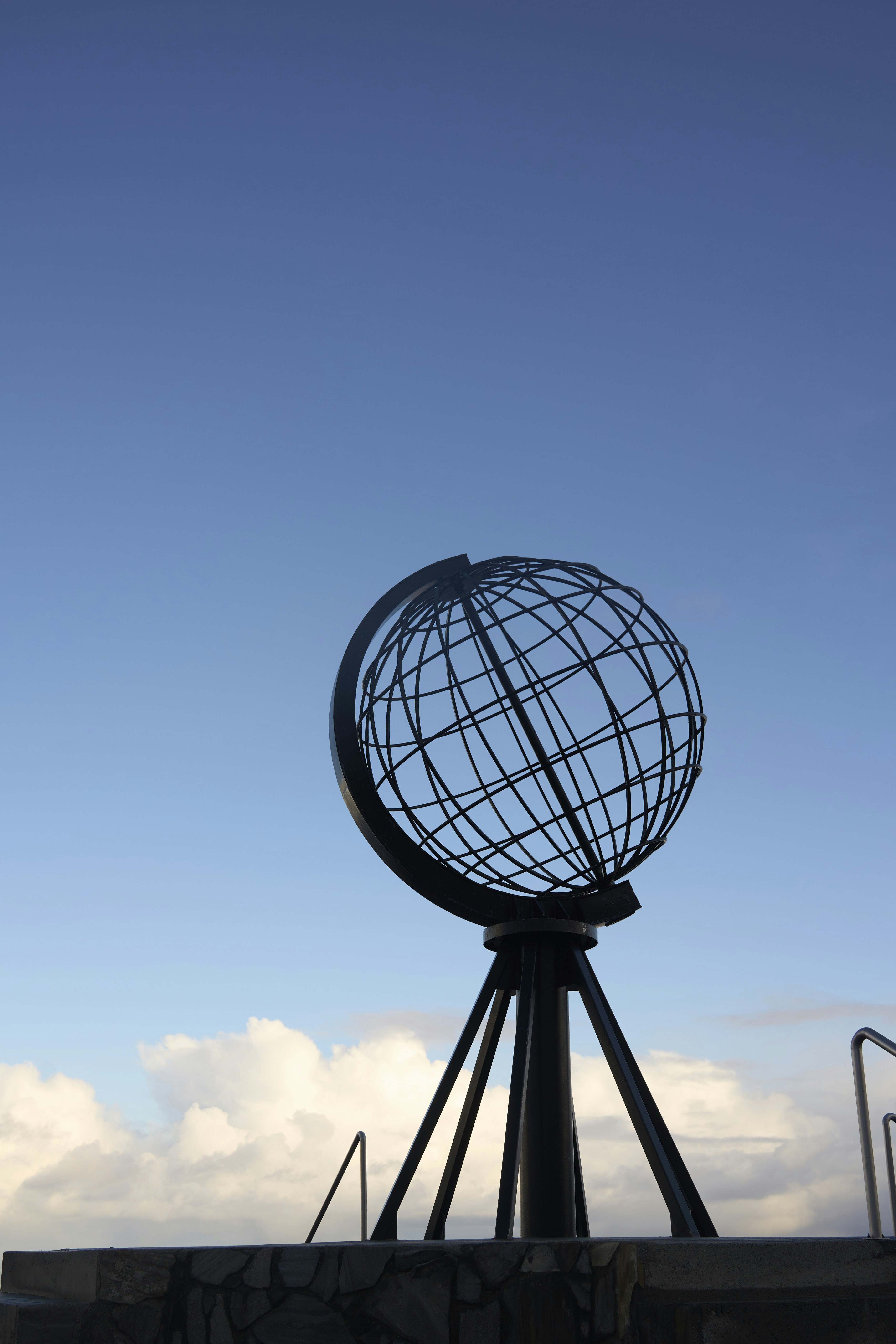 Globe in Orbit: A Quiet Monument Against a Clear Sky