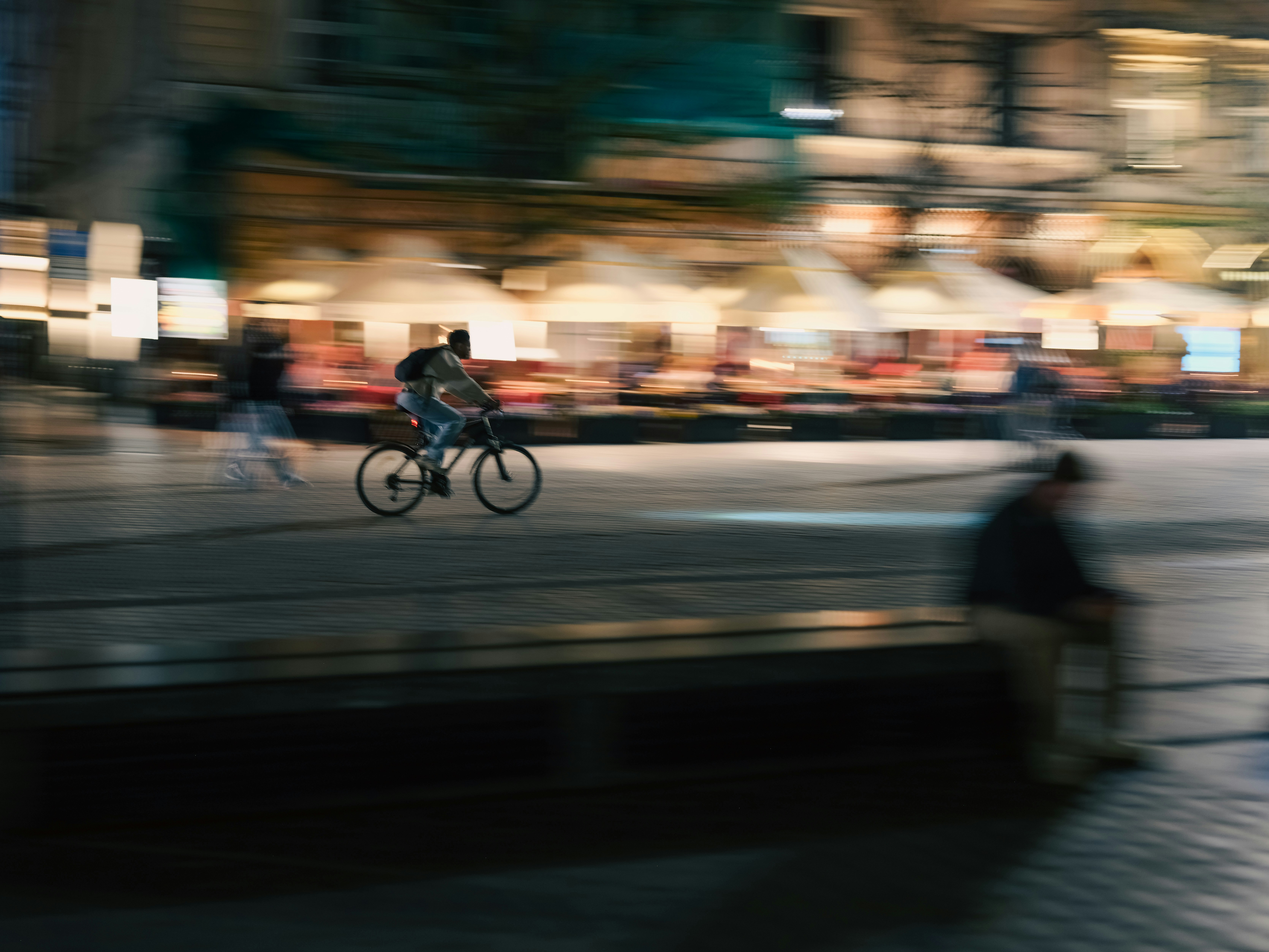 Midnight Rider: A Bicycle Traveler Through Blurred City Lights