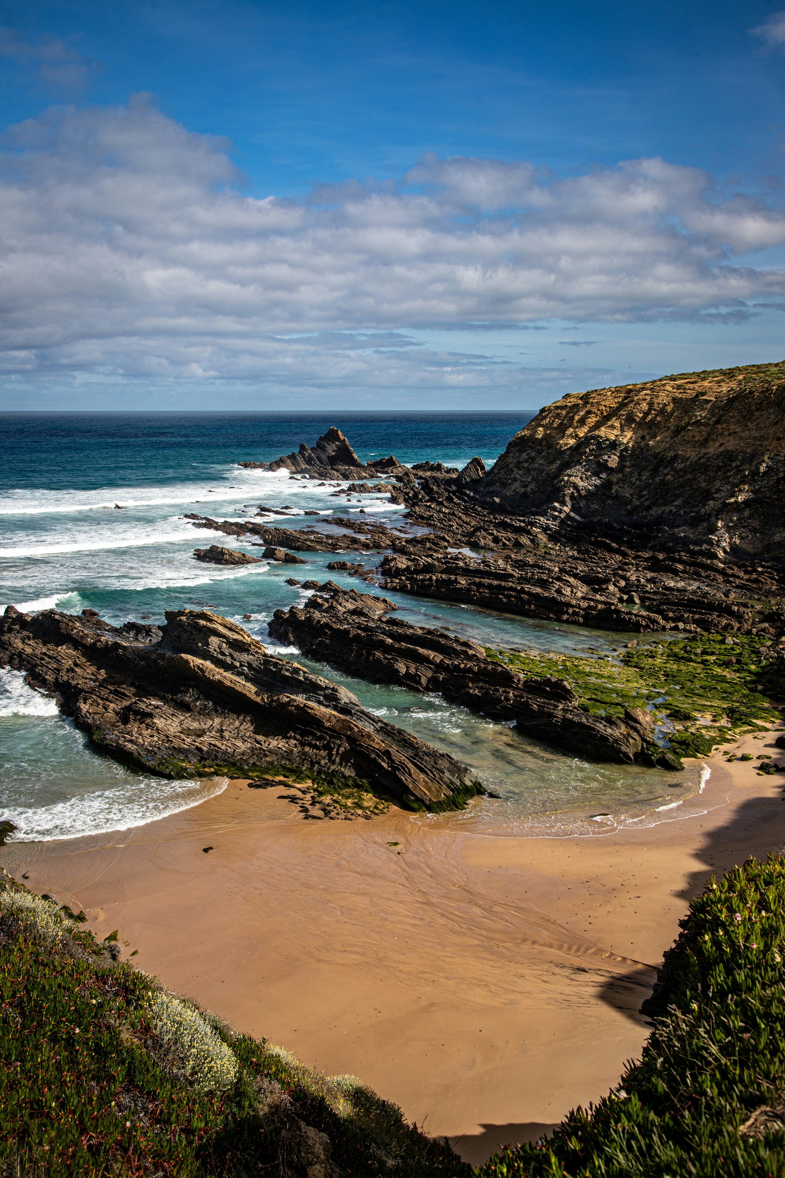 Coastal Cliffs and Tide Pools beneath a Clear Sky