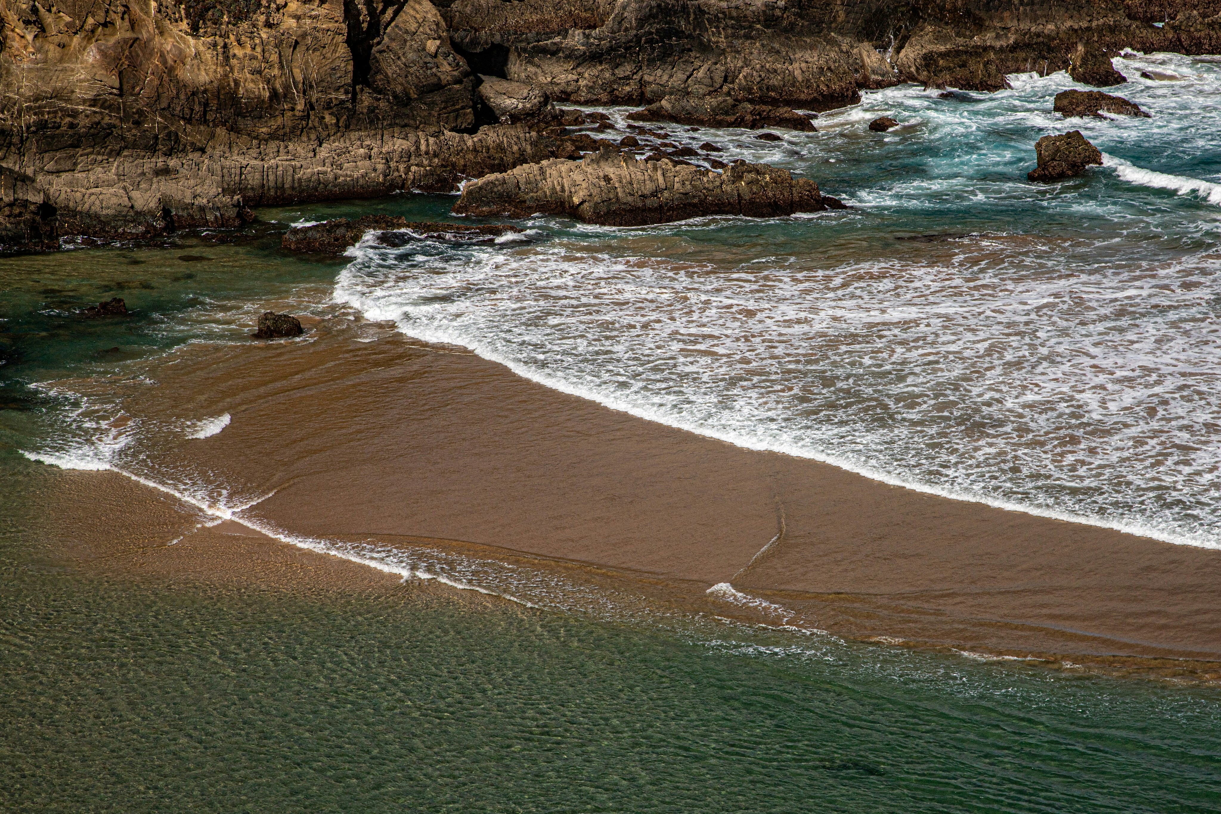 Coastal Sandbar Where Sea Meets Shoreline