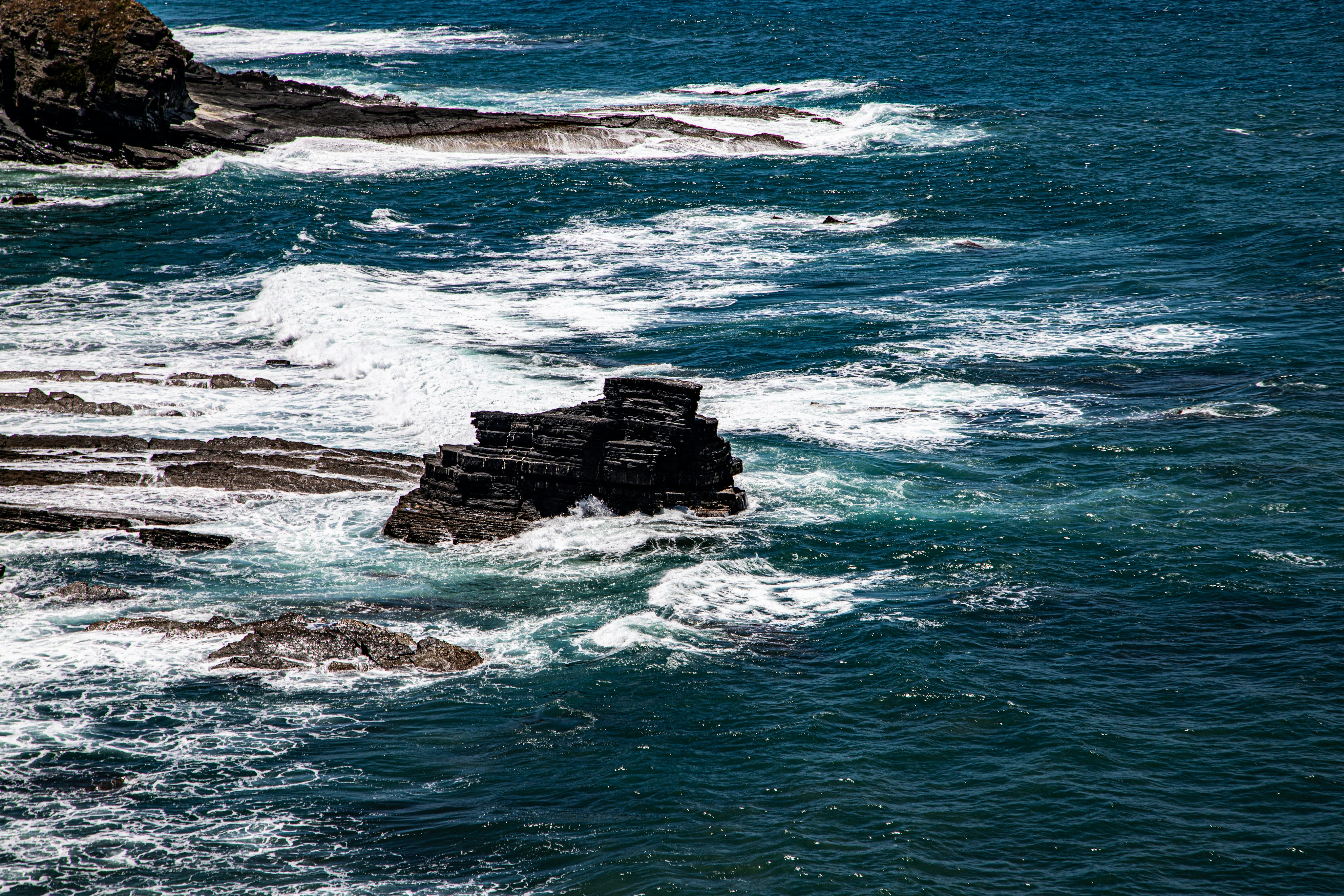 Rogue Tide: A Quiet Stack of Basalt Boulders Quietly Guarding the Blue