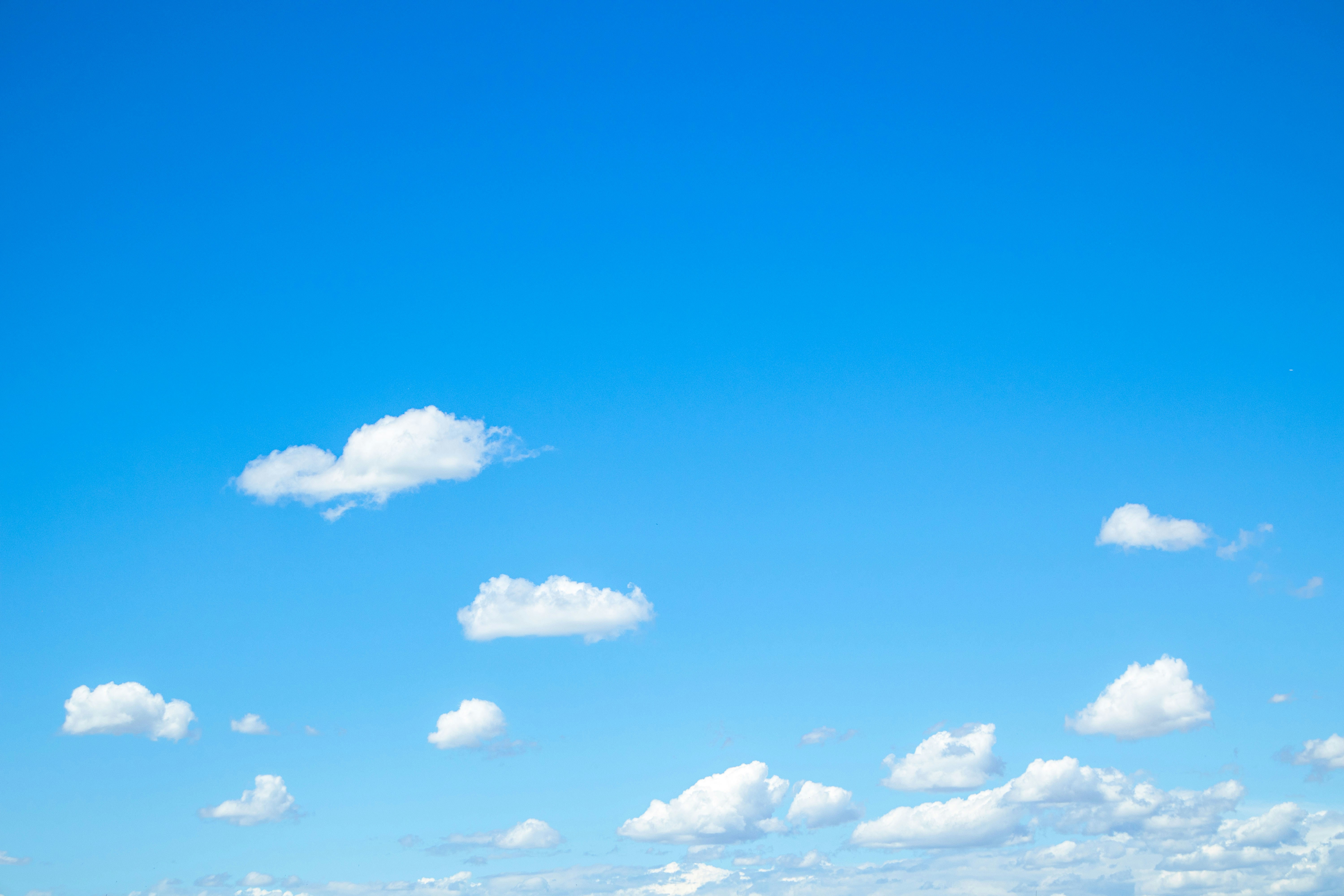 Blue Aether: A Sky Stippled with Whimsical Clouds
