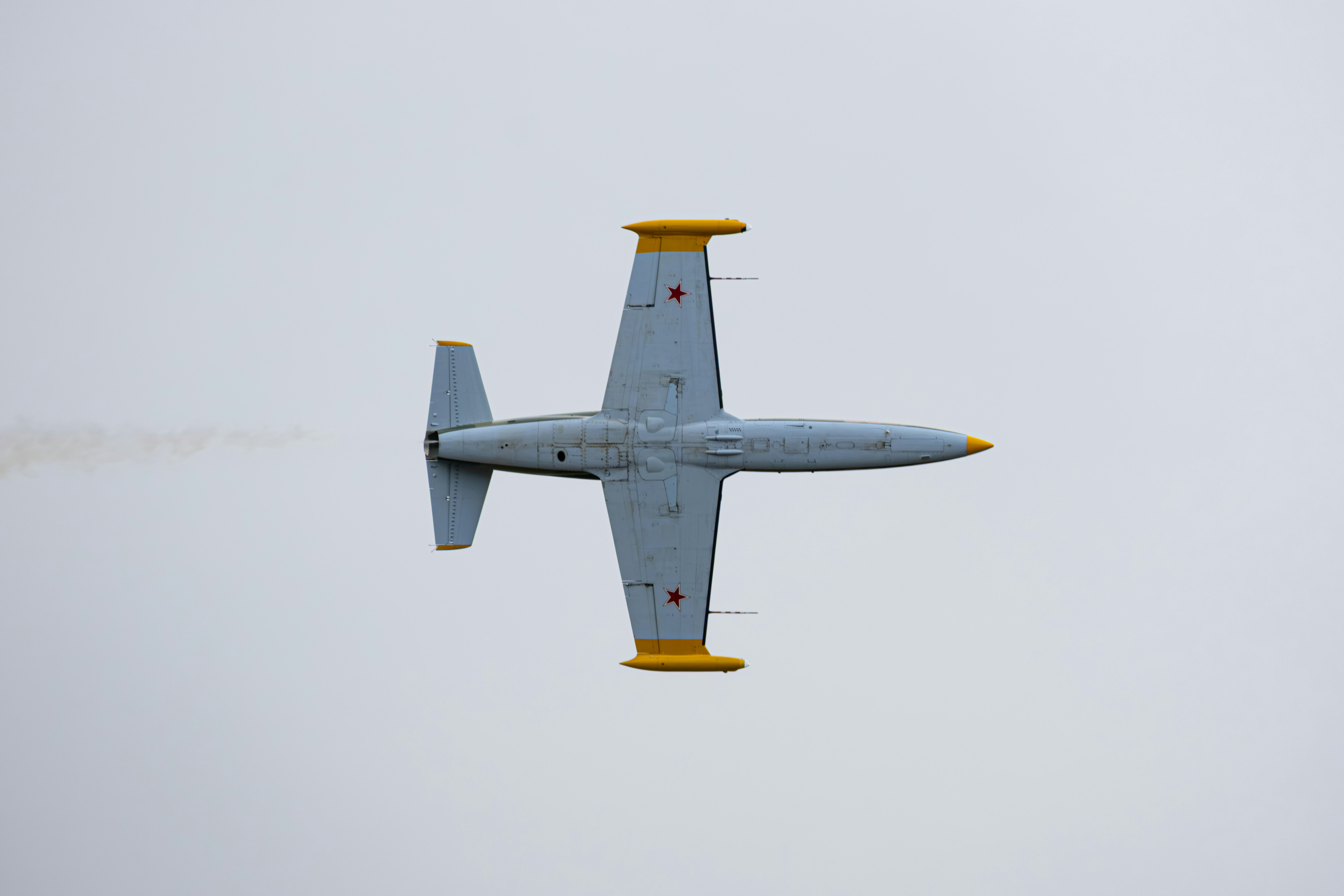 Midair Precision: A Jet Dominates a Sea of Gray